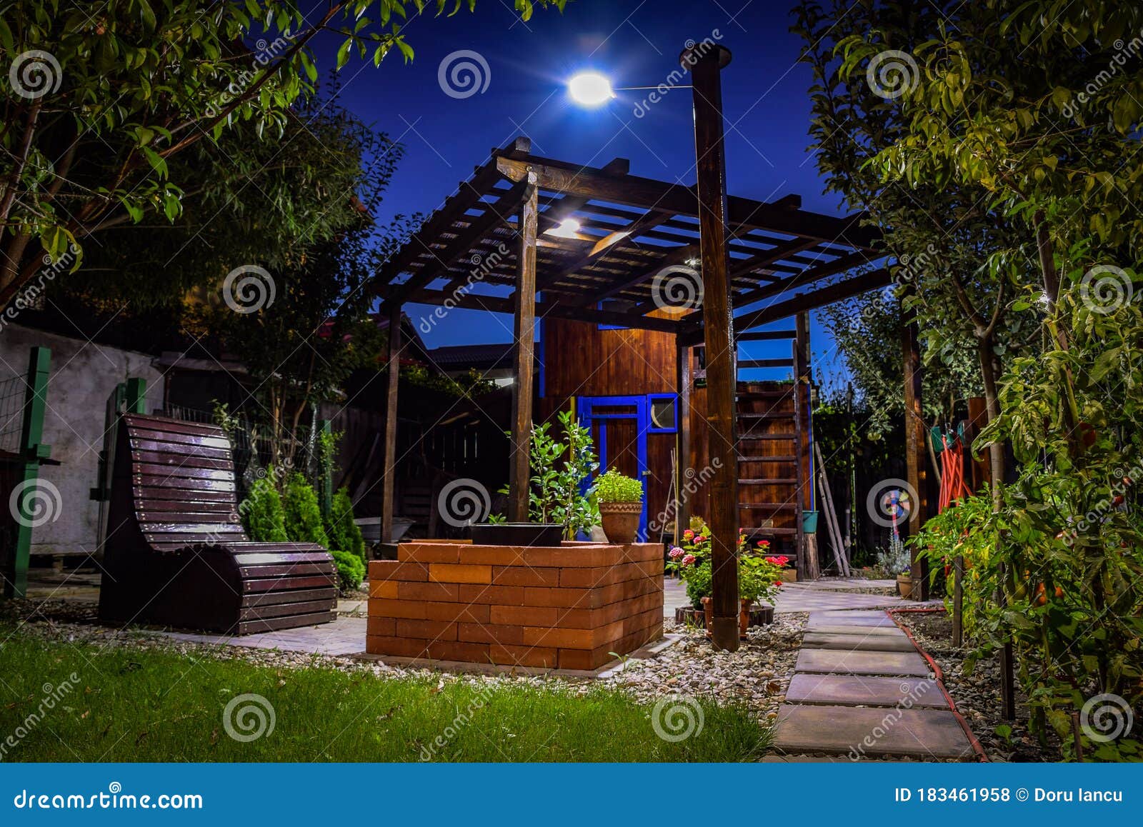 Backyard garden at night stock photo. Image of night - 183461958