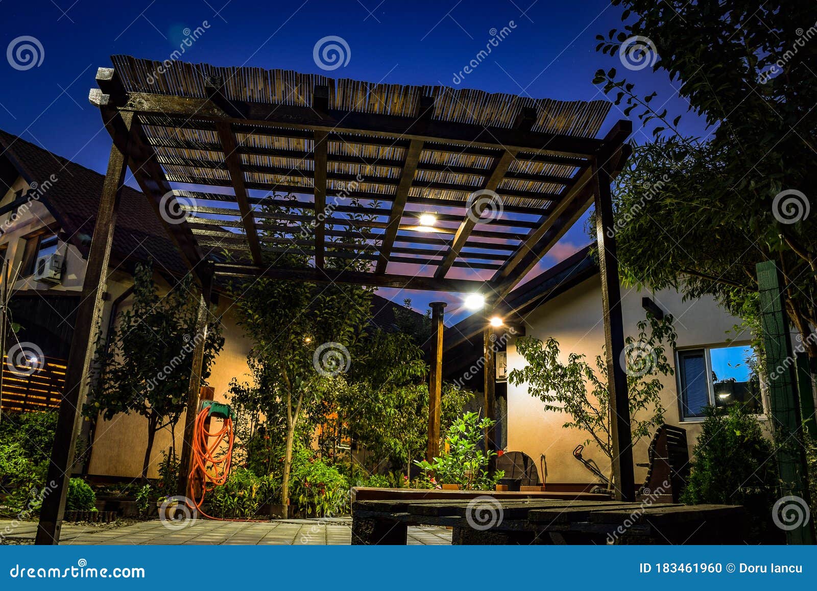 Backyard garden at night stock photo. Image of spot - 183461960