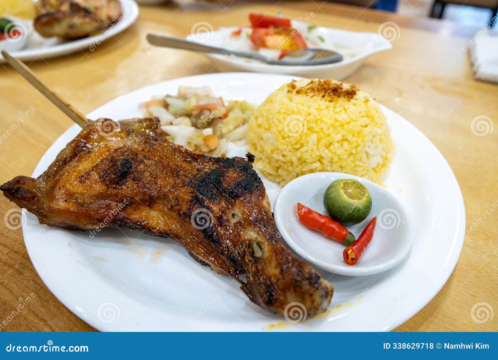 Bacolod Style Inasal Chicken with Java Rice and Vegetables Stock Photo ...