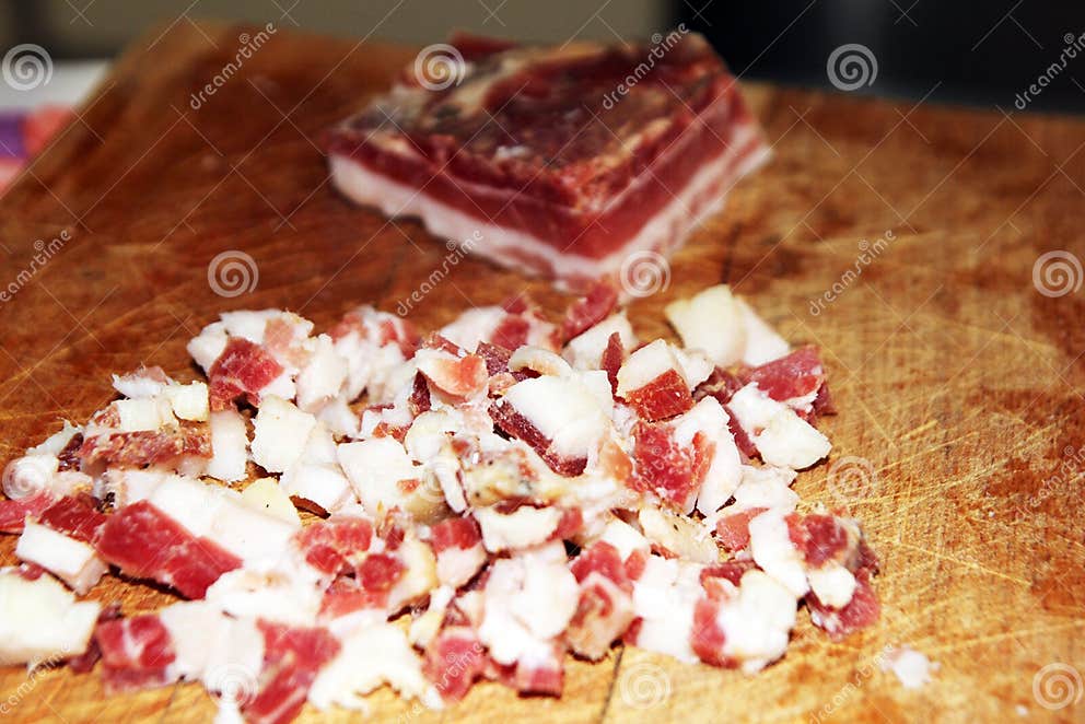 Bacon cubes stock photo. Image of cutting, hands, cube - 73679366
