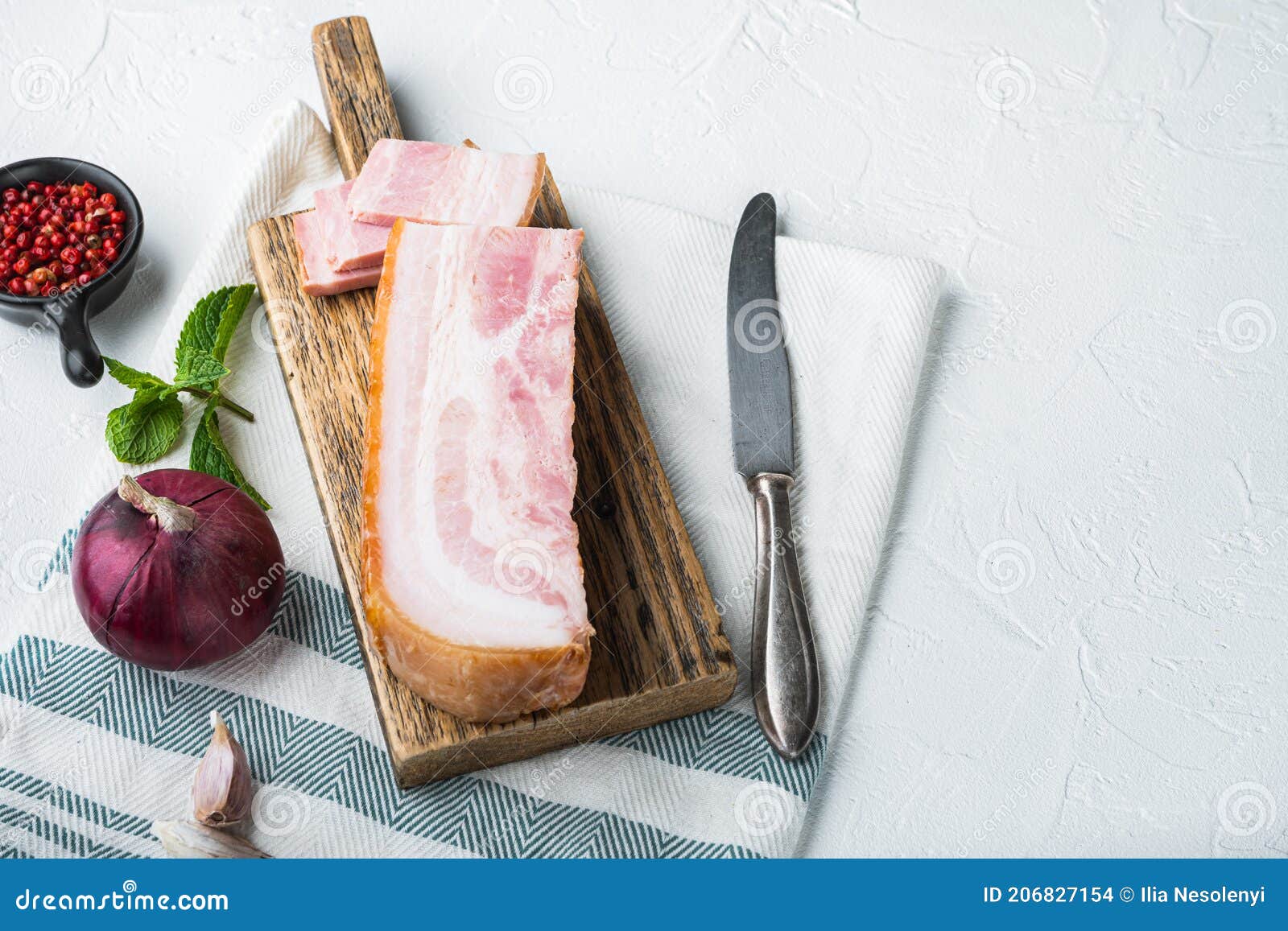 Bacon Pancetta Cut and Sliced with Herbs on White Background with Space ...