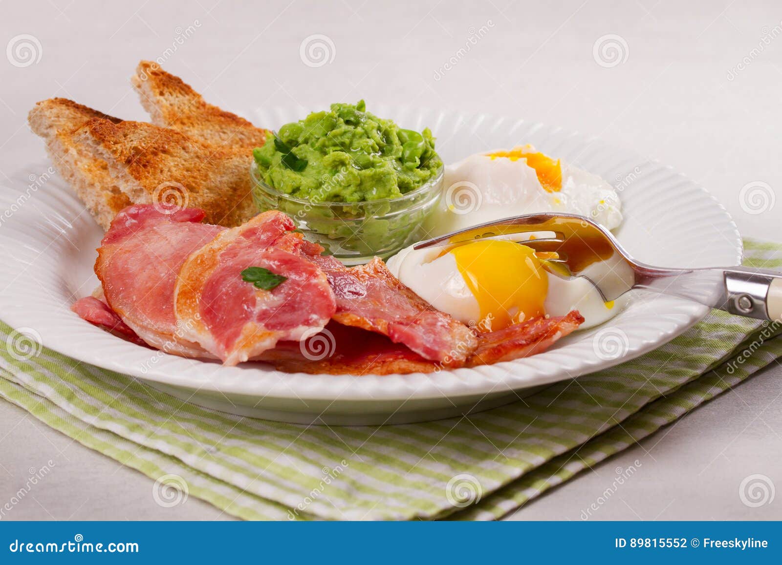 Bacon, Poached Eggs, Mashed Peas and Toasts on White Plate. Grilled ...
