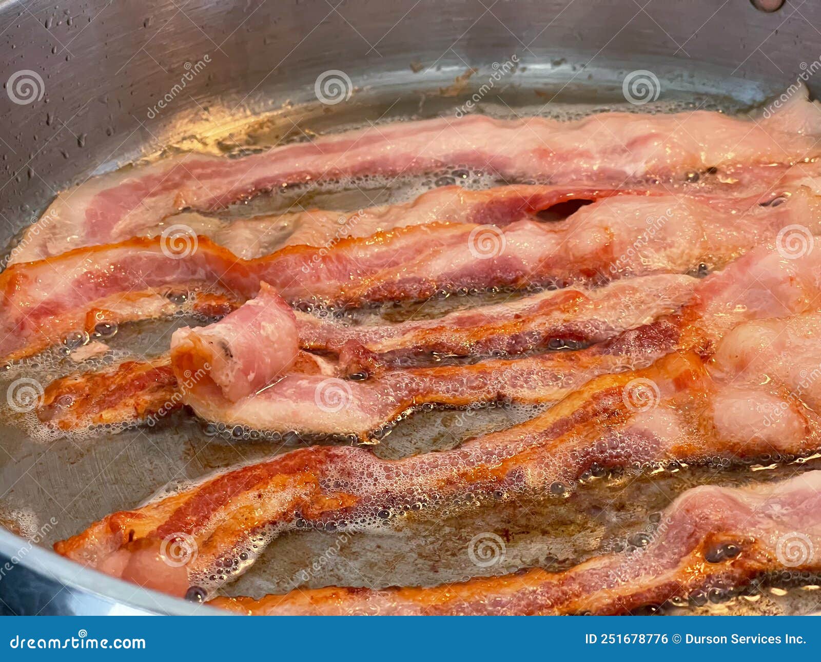 Bacon Sizzling in Hot Skillet. Stock Photo - Image of fatty, simple ...
