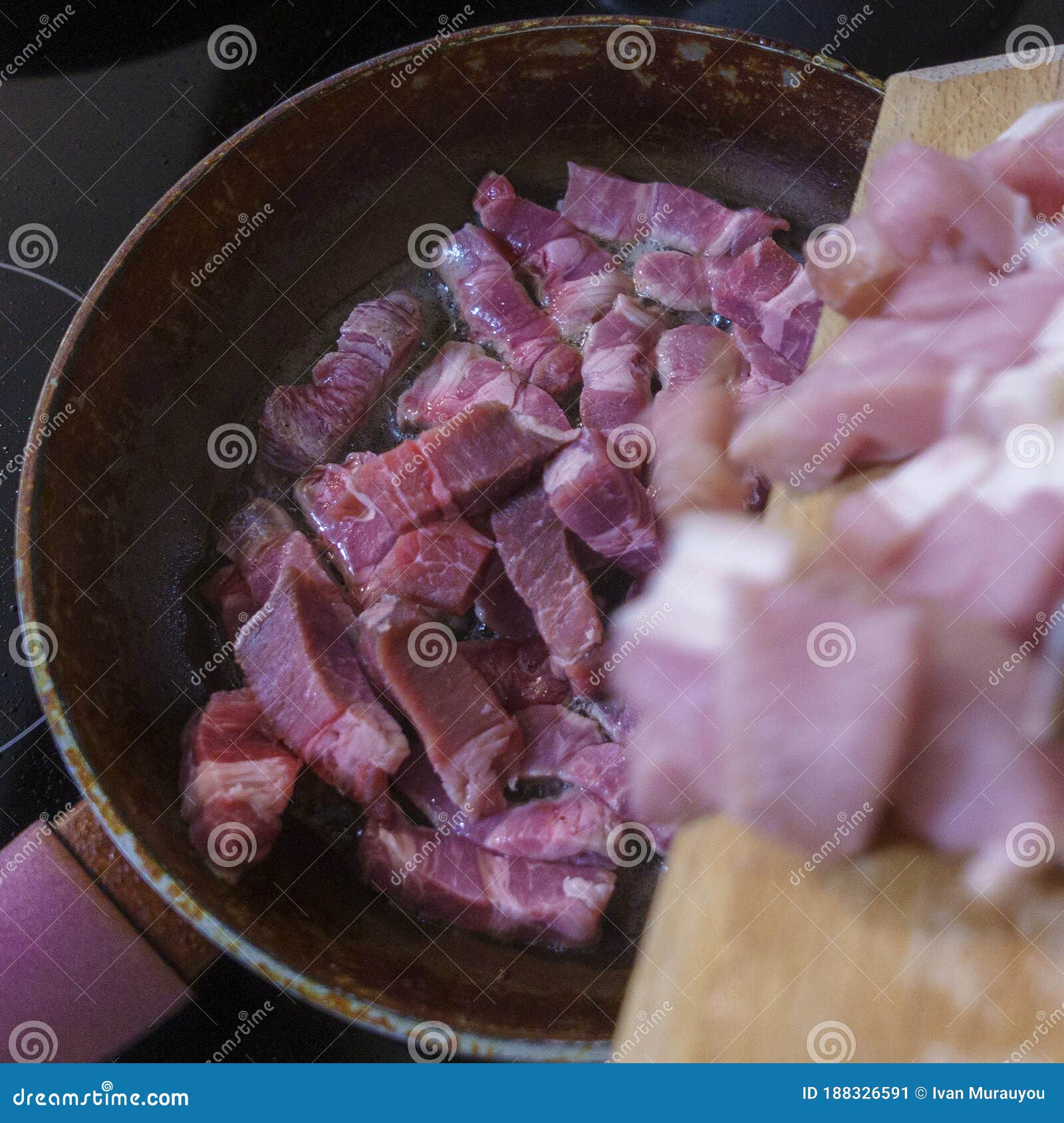 Bacon Slice Being Cooked in Frying Pan. Raw Red Bacon. Cooking Concept ...