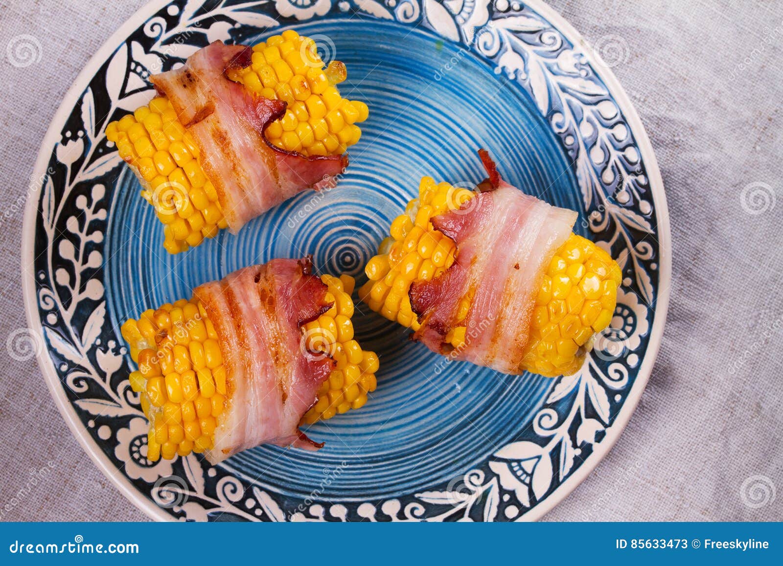 Bacon Wrapped Corn on Blue Plate. Stock Image - Image of barbecue ...