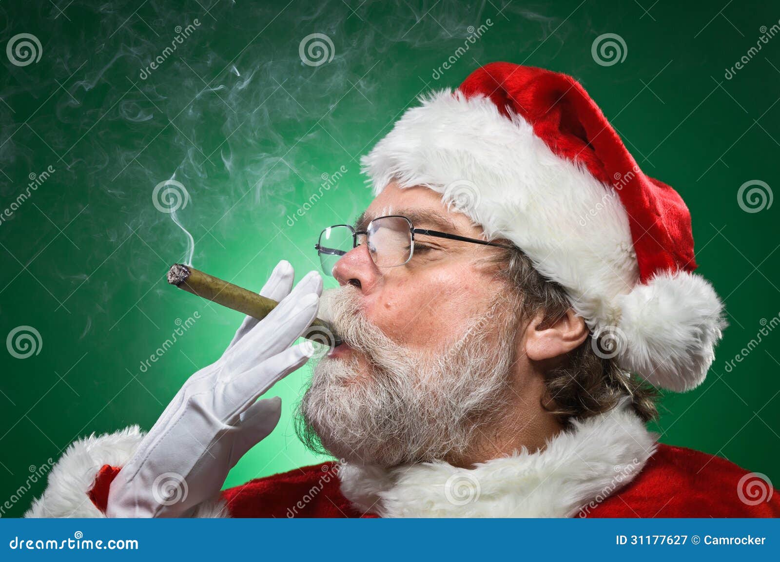 Bad Santa Lighting a Cigar stock image. Image of holiday - 31177627