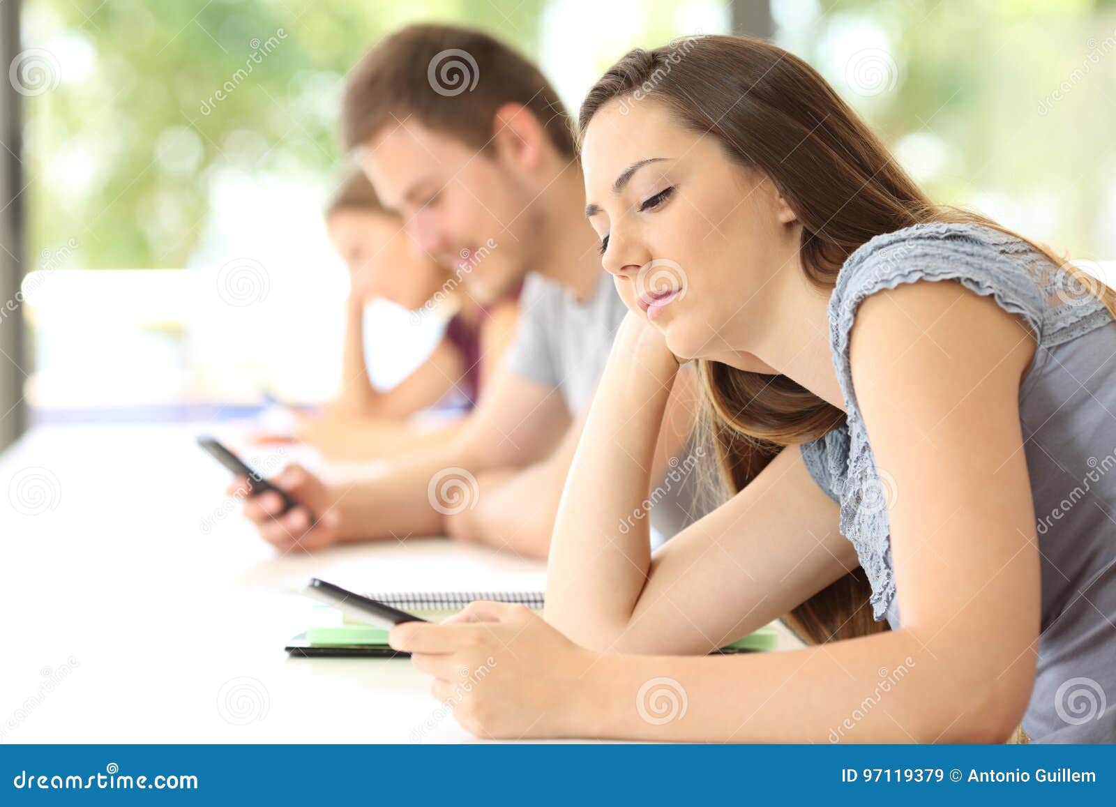 Bad Students Distracted Using Phones during a Class Stock Image - Image ...