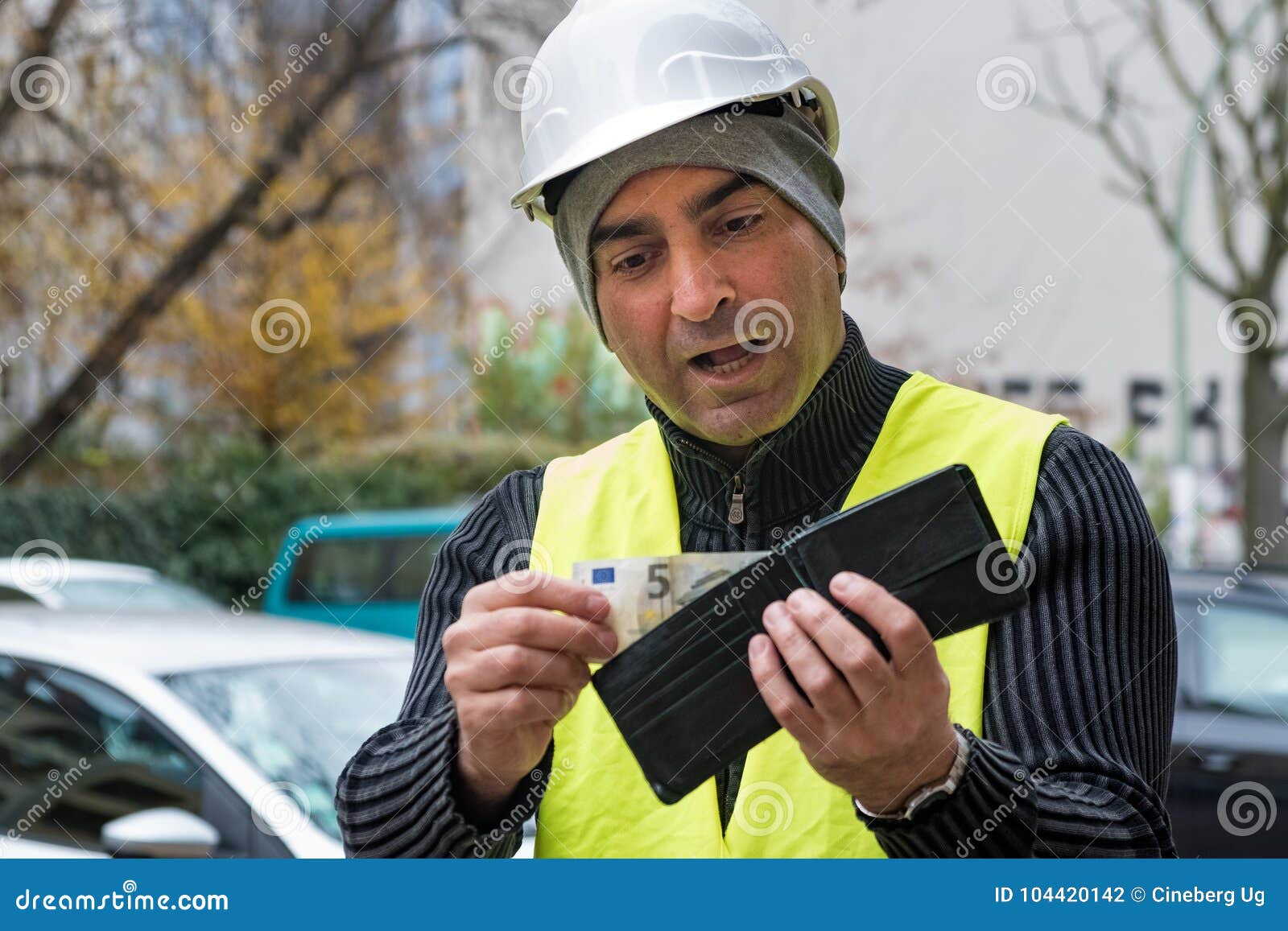 Bad Surprise: Construction Worker and His Empty Wallet Stock Photo ...