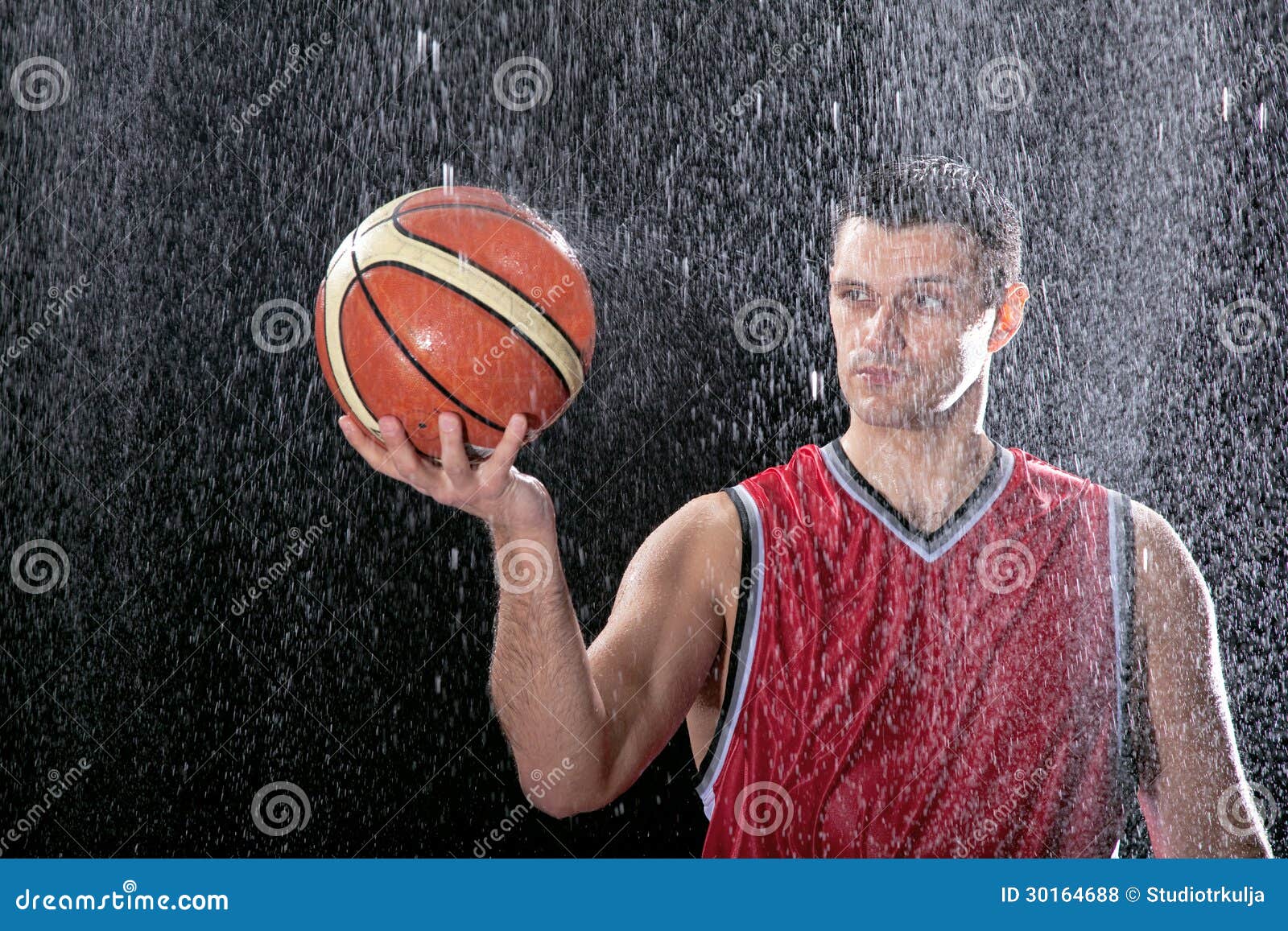 Basketball Player Looking at His Ball Stock Photo - Image of indoor ...