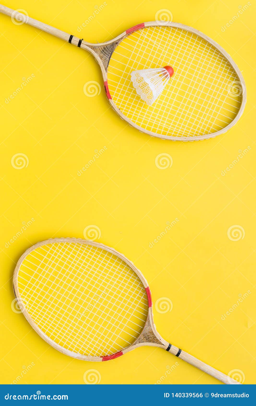 Badminton Concept. Badminton Rackets and Shuttlecock on Yellow ...