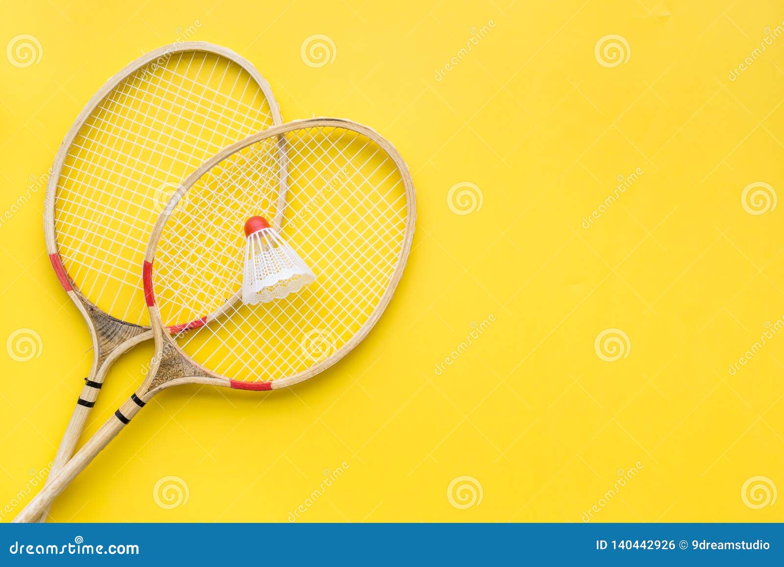 Badminton Concept. Badminton Rackets and Shuttlecock on Yellow ...