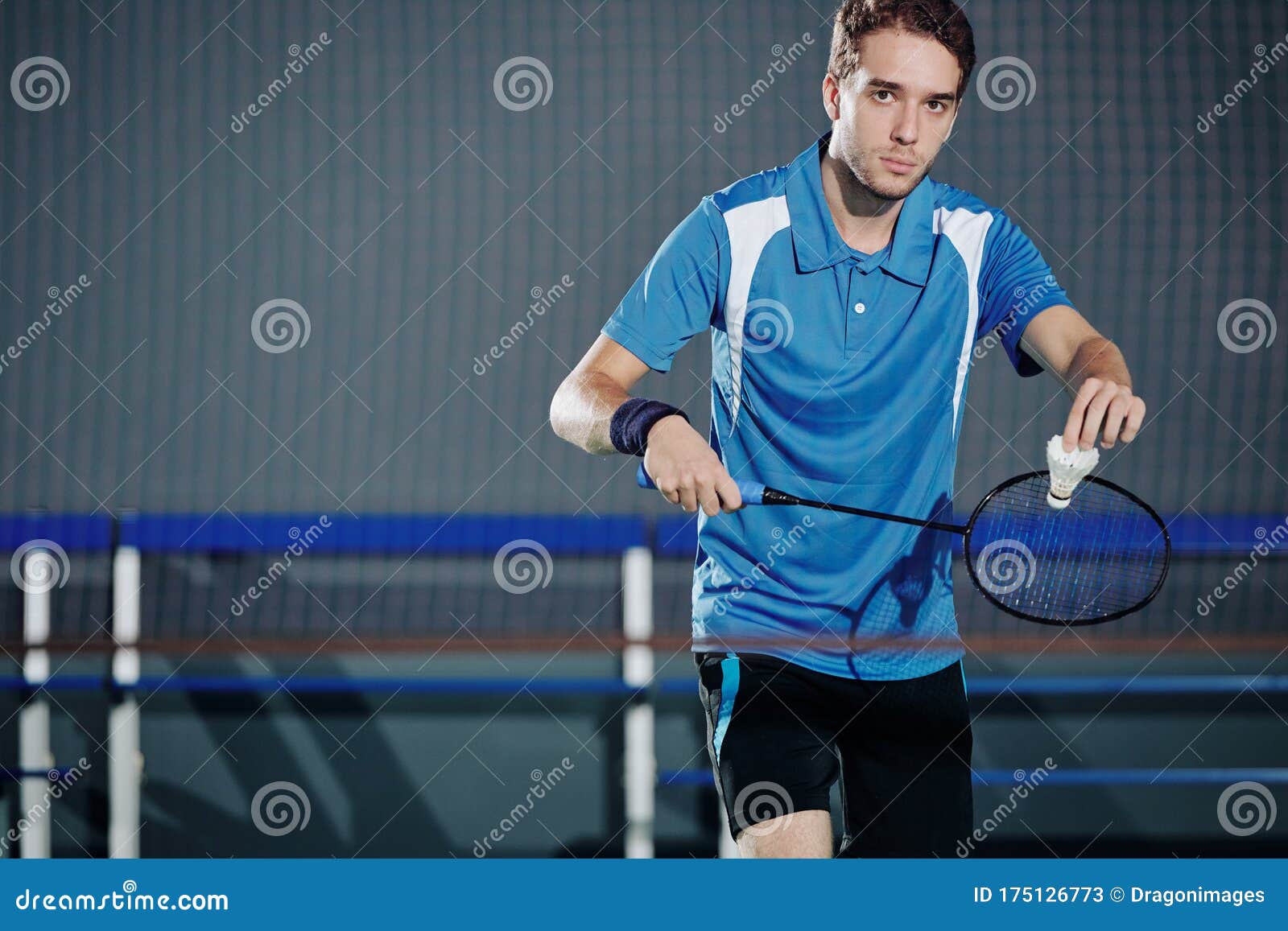 Badminton Player Serving Shuttlecock Stock Image - Image of lifestyles ...