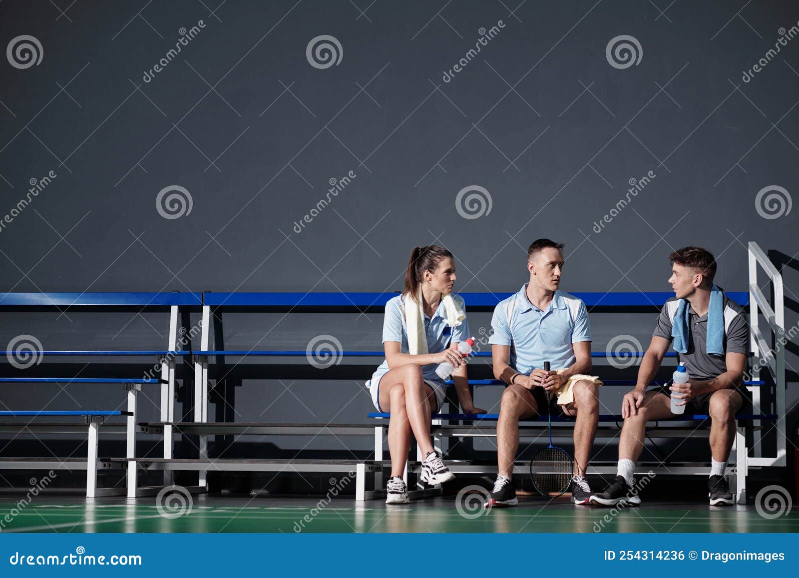 Badminton Players Resting on Bench Stock Photo - Image of young, court ...