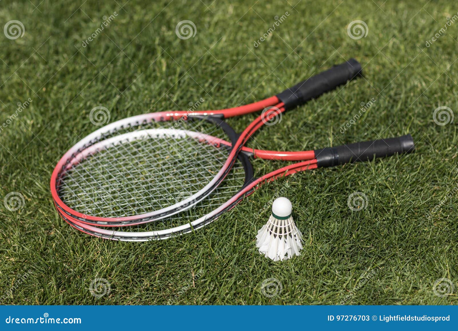 Badminton Rackets with Shuttlecock on Grass Stock Image - Image of ...