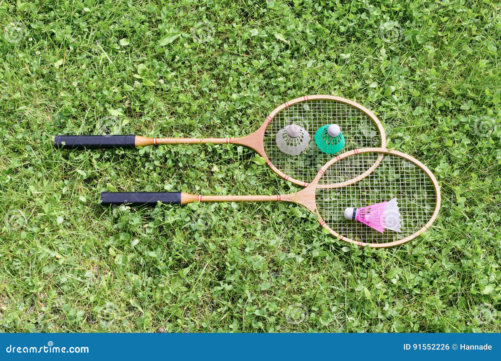 Badminton Rackets and Shuttlecocks on Grass Stock Photo - Image of ...
