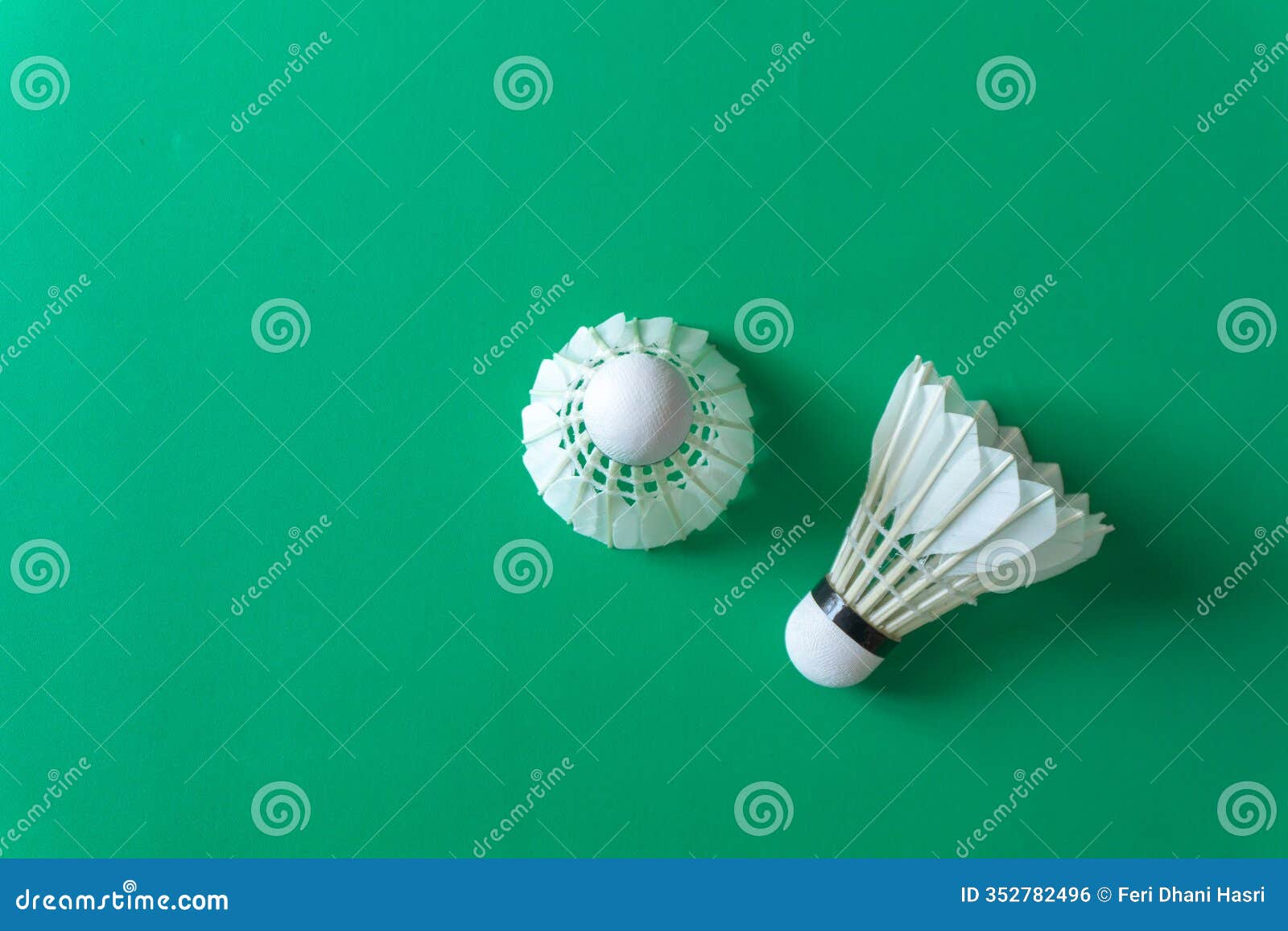 Badminton Rackets and Shuttlecocks on Green Background. Copy Space ...