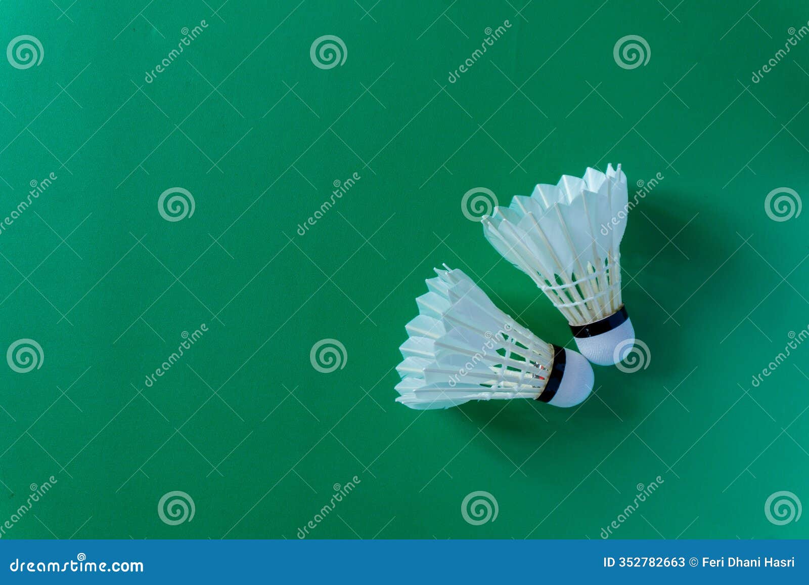 Badminton Rackets and Shuttlecocks on Green Background. Copy Space ...