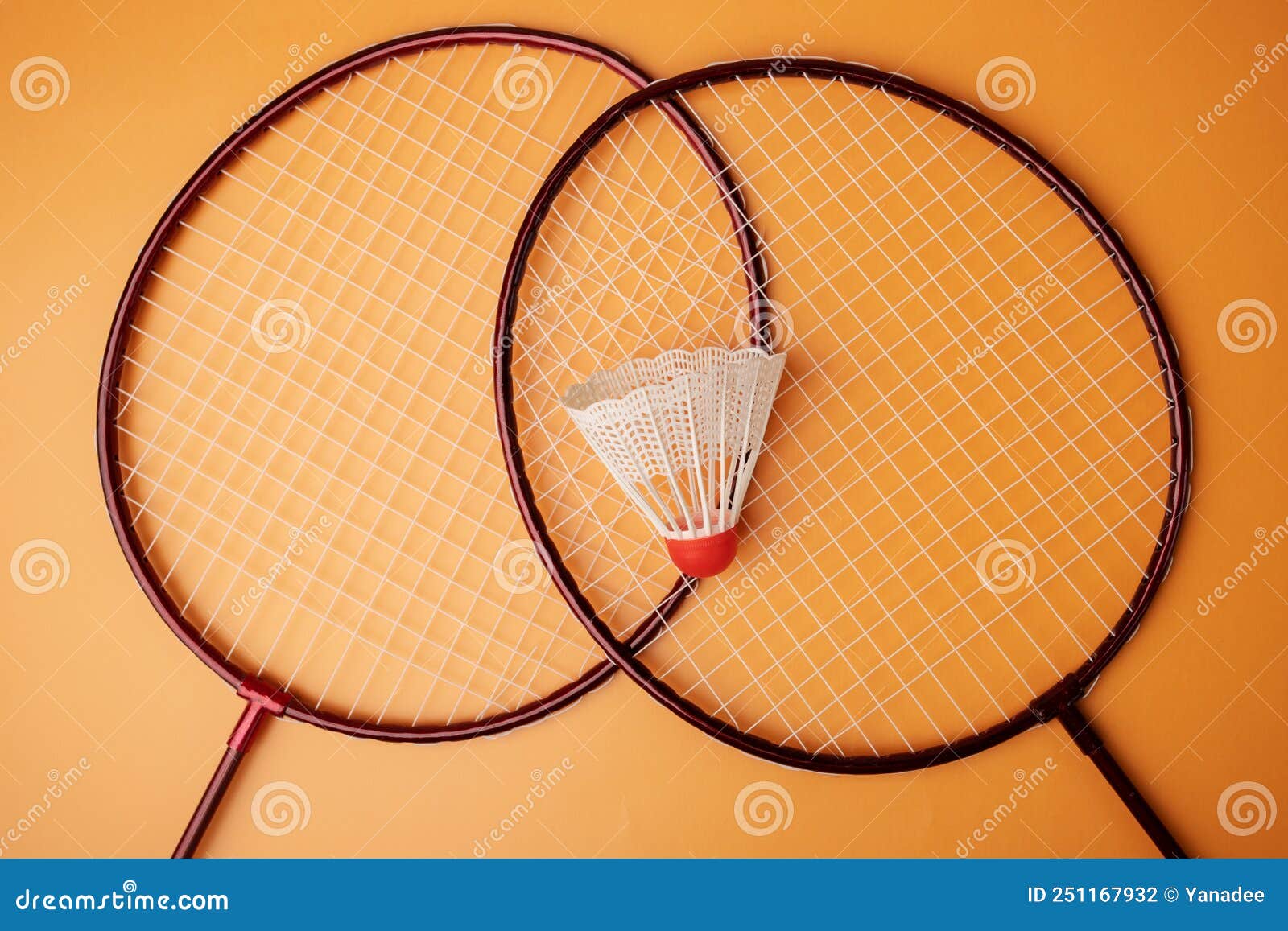 Badminton, Shuttlecock and Two Rackets on Orange Background Stock Photo ...