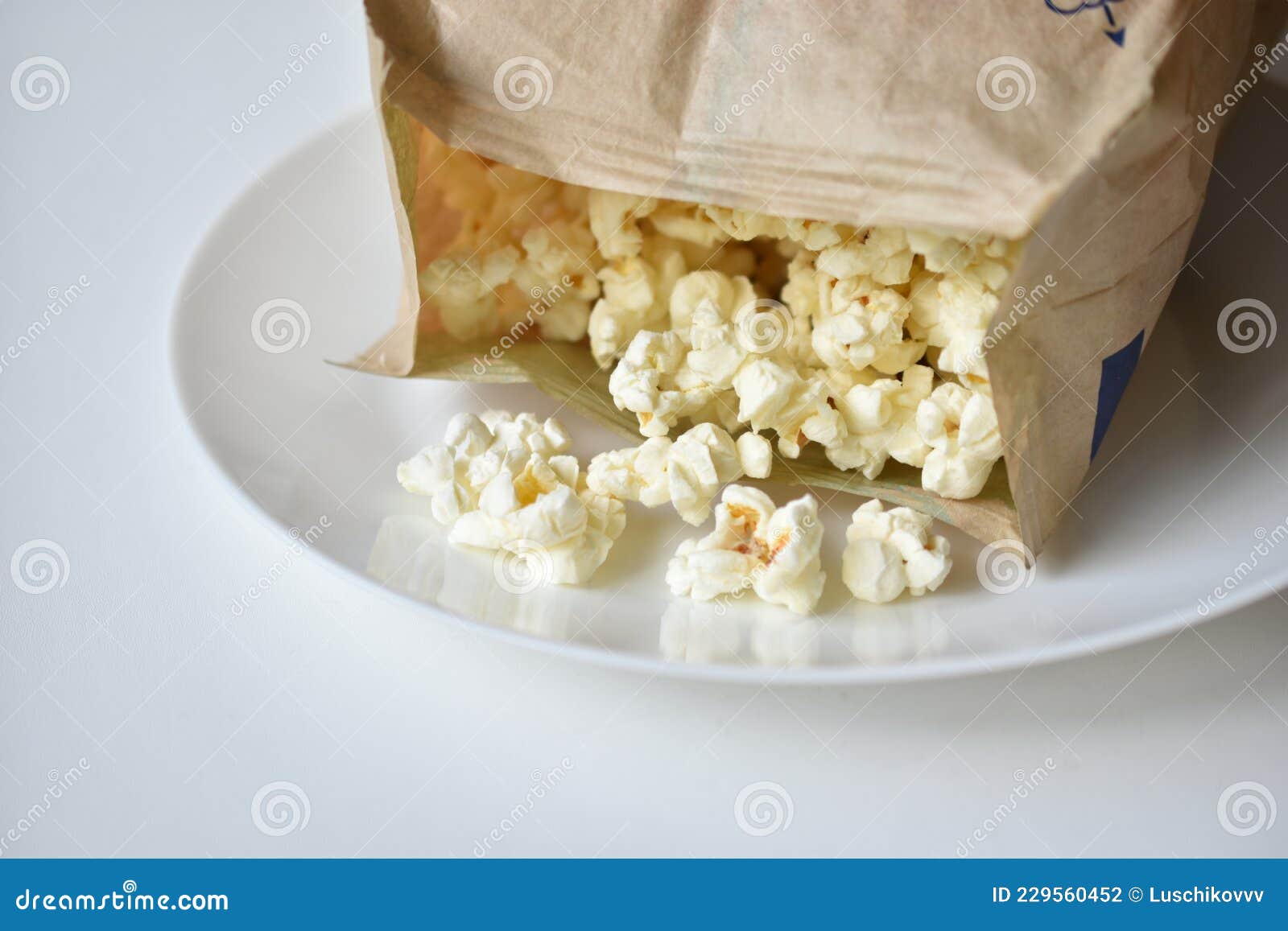 A Bag of Popcorn Open on a Plate in the Kitchen Stock Photo - Image of ...