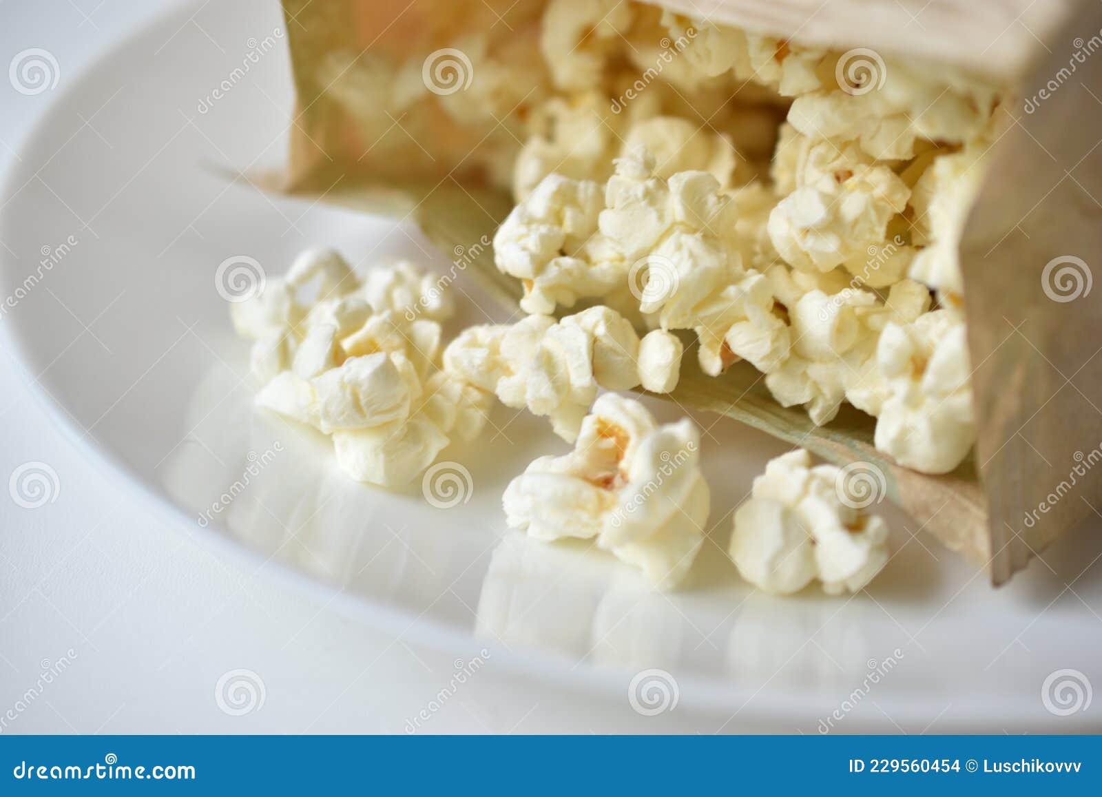A Bag of Popcorn Open on a Plate in the Kitchen Stock Photo - Image of ...