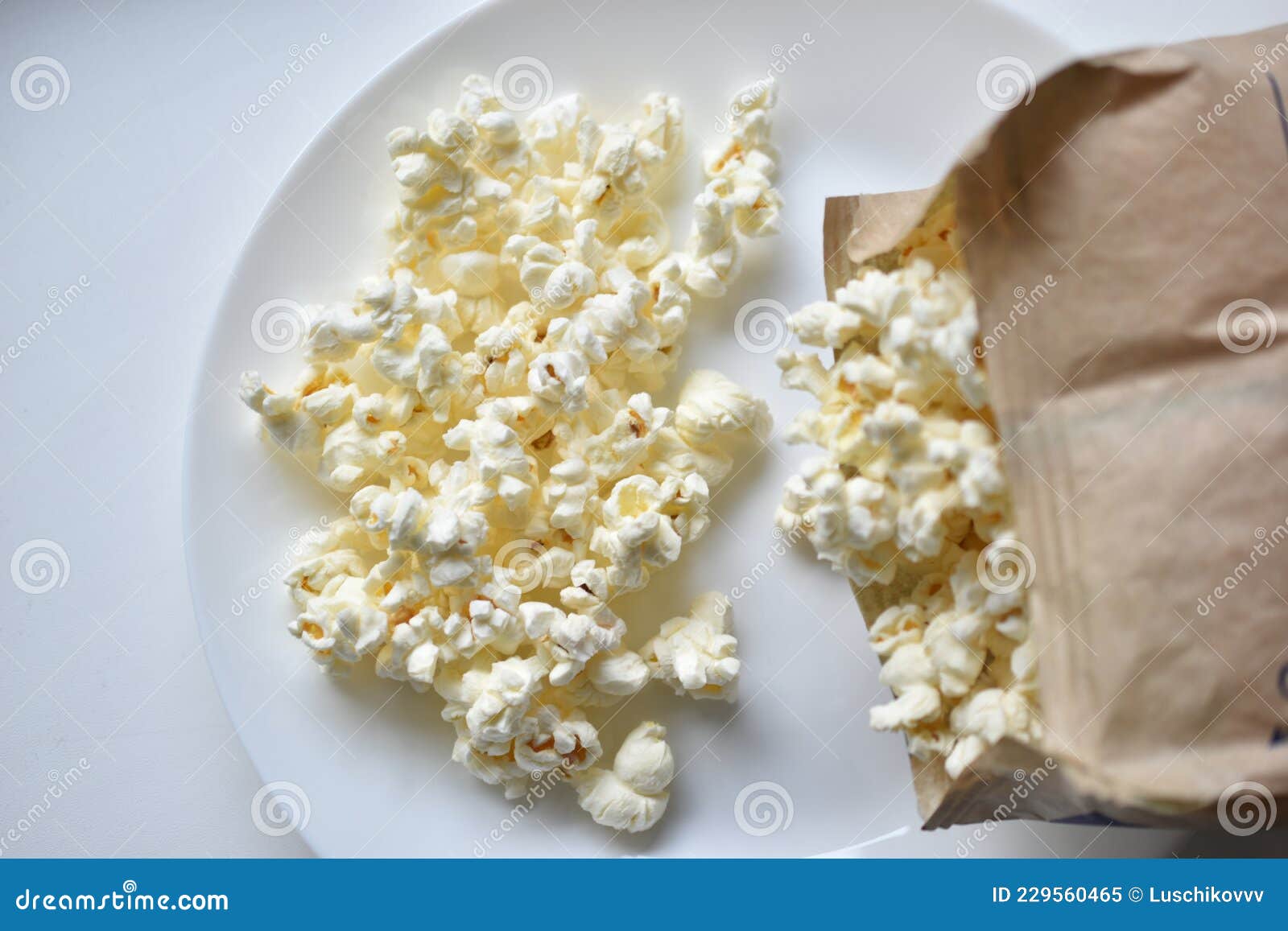 A Bag of Popcorn Open on a Plate in the Kitchen Stock Image - Image of ...