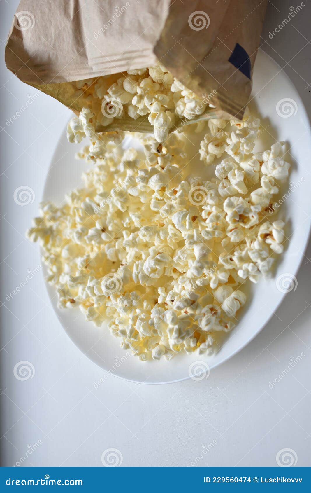 A Bag of Popcorn Open on a Plate in the Kitchen Stock Photo - Image of ...