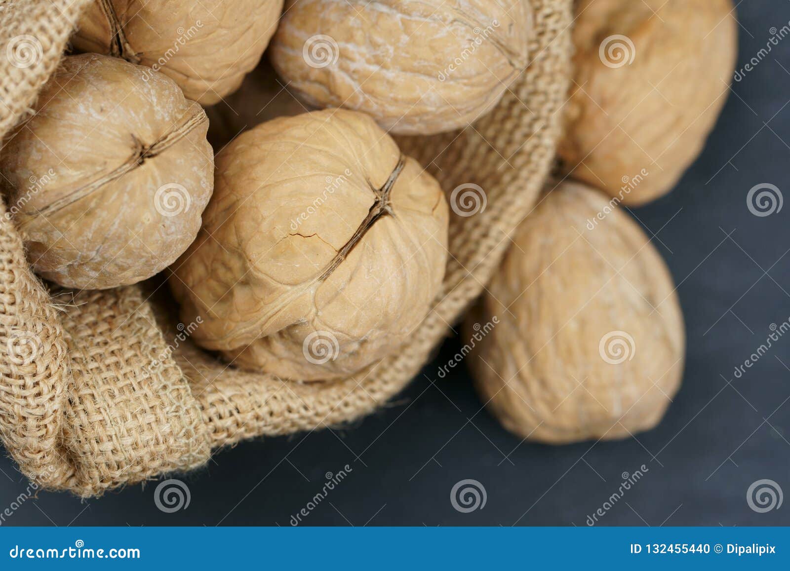 A bag of unshelled Walnuts stock photo. Image of ripe - 132455440