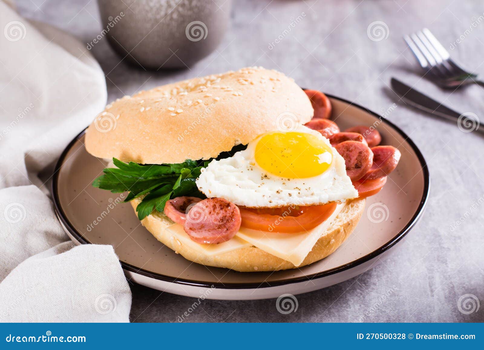 Bagel with Heart-shaped Boiled Egg, Tomato, Cheese and Herbs on a Plate ...