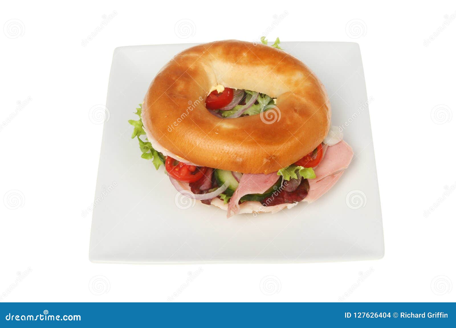 Bagel on a plate stock photo. Image of sandwich, meal - 127626404