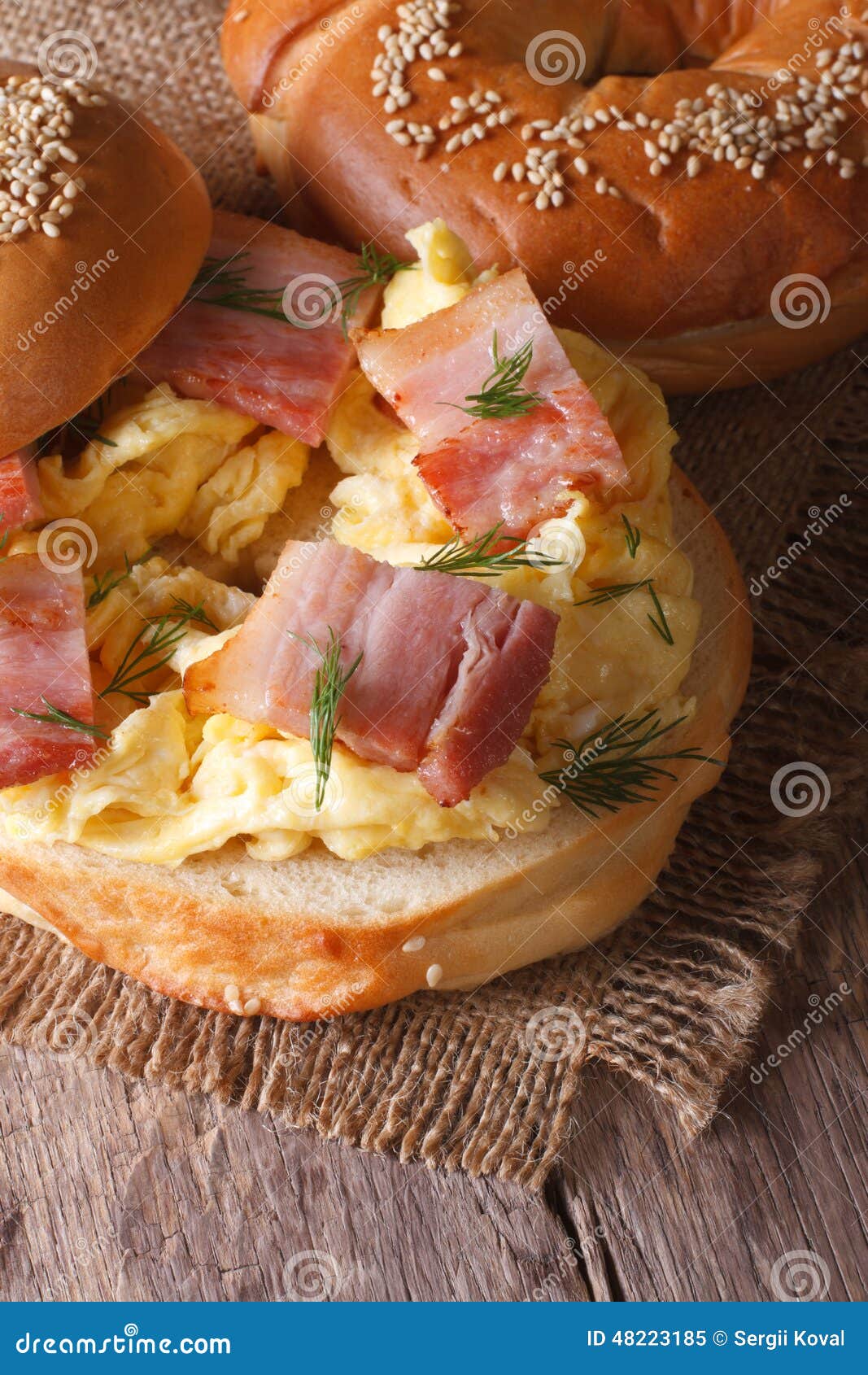 Bagel with Scrambled Eggs and Bacon Close-up Vertical Stock Image ...