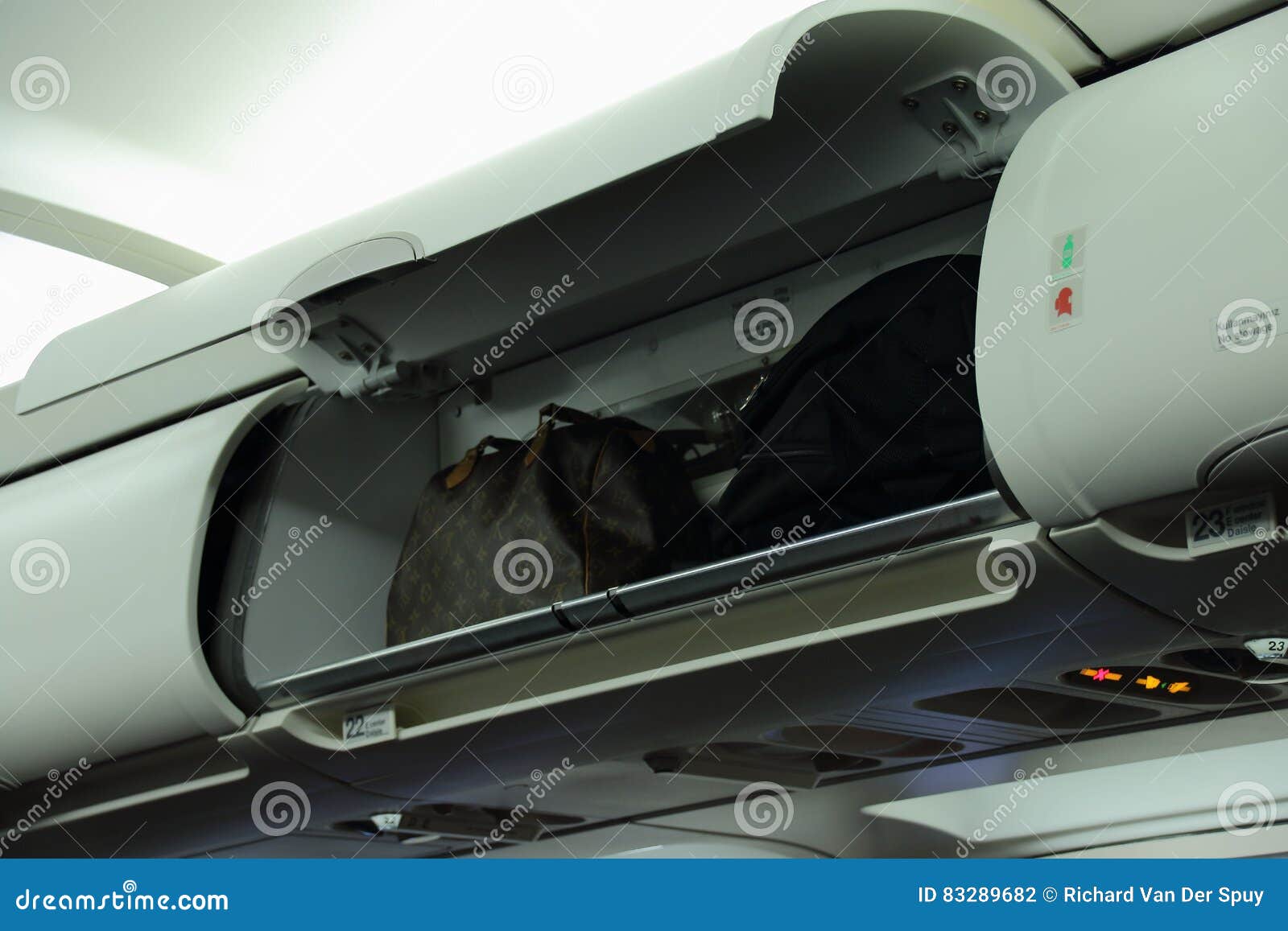 Baggage in Overhead Locker on Aircraft Editorial Photography - Image of ...