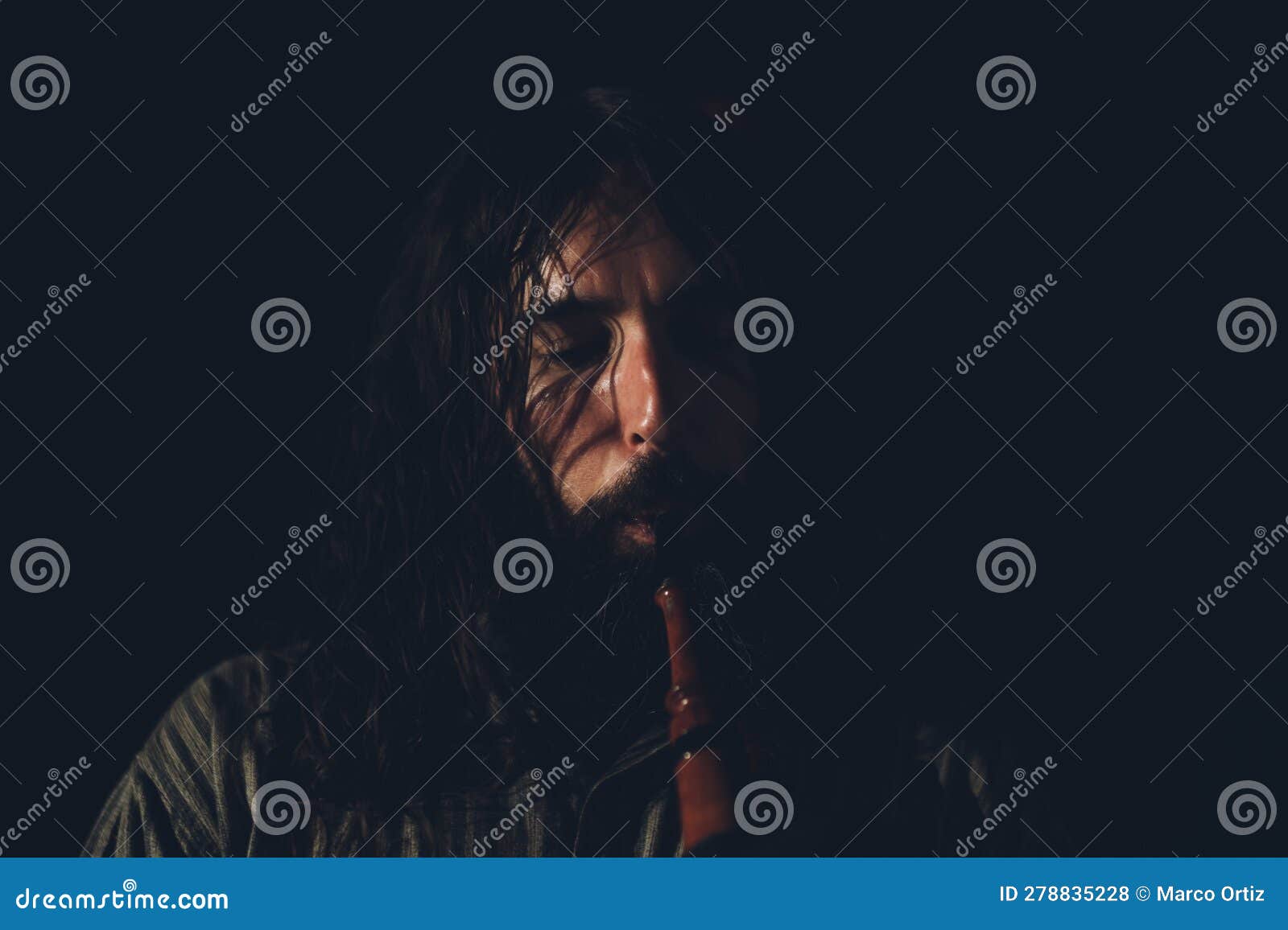 Bagpipe Player Playing His Instrument in an Auditorium with Stage ...