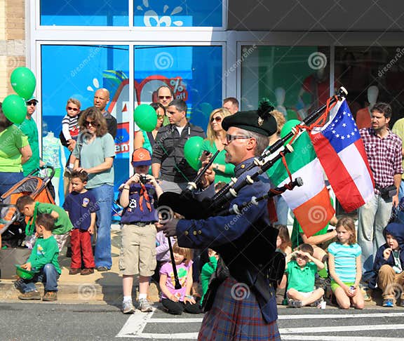 Bagpiper with Flags editorial photo. Image of outside - 23892476