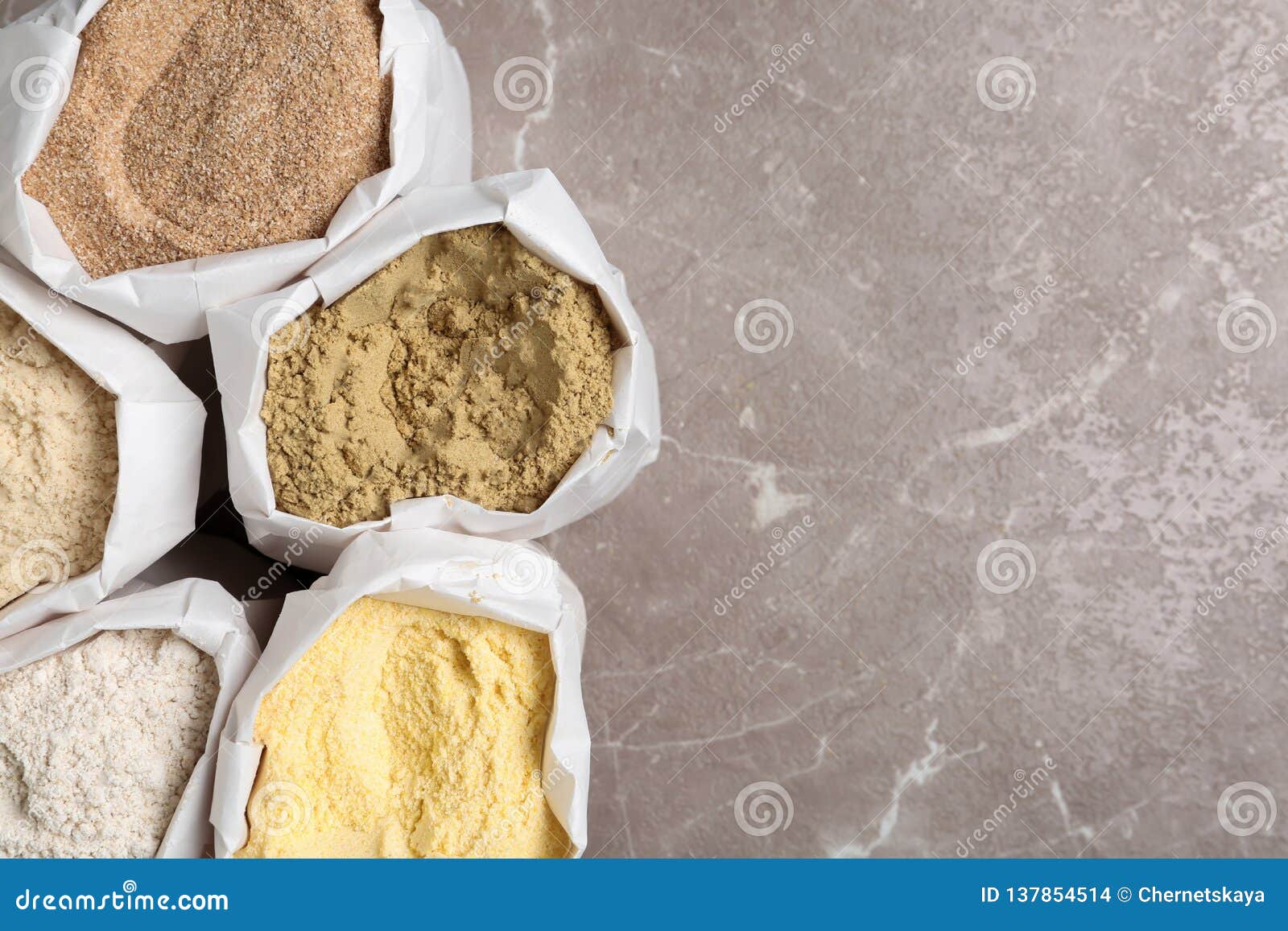 Bags with Different Types of Flour on Grey Background, Top View Stock ...