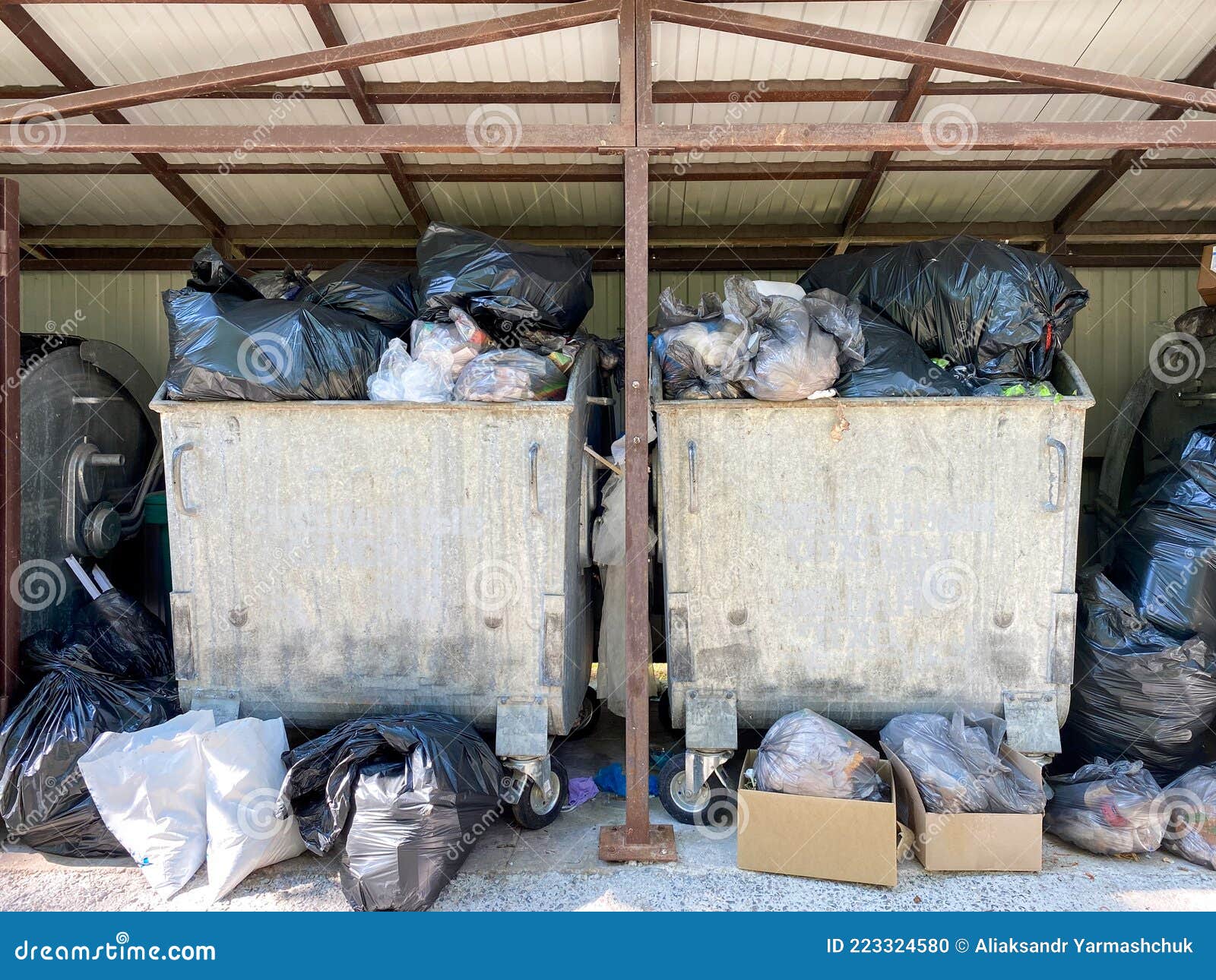 Bags of Garbage are in the Trash Container. a Lot of Garbage Was Thrown ...