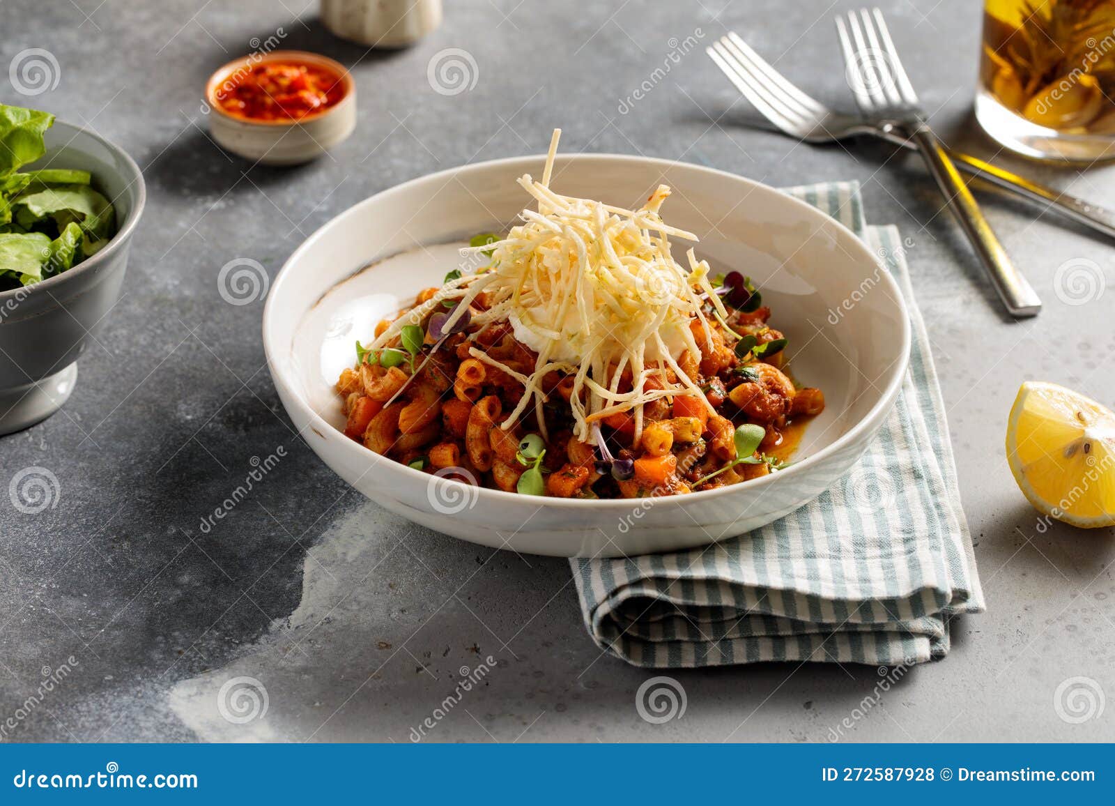 Bahrani Macaroni with Lime and Chilli Sauce Served in Dish Isolated on ...