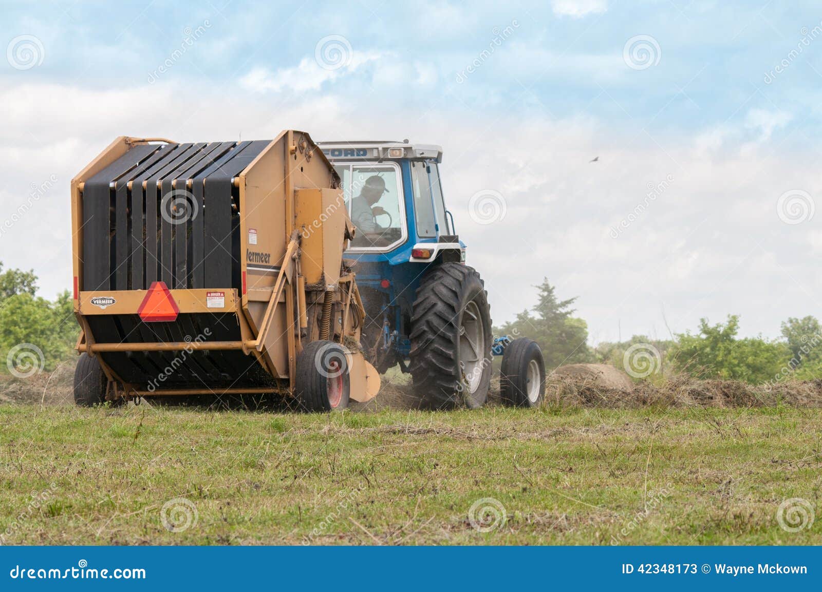 Bailing hay in the summer editorial stock photo. Image of agricultural ...