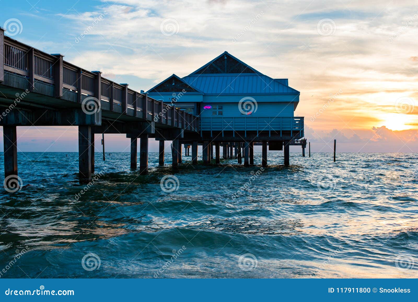 Store and Pier on beach stock photo. Image of long, beach - 117911800