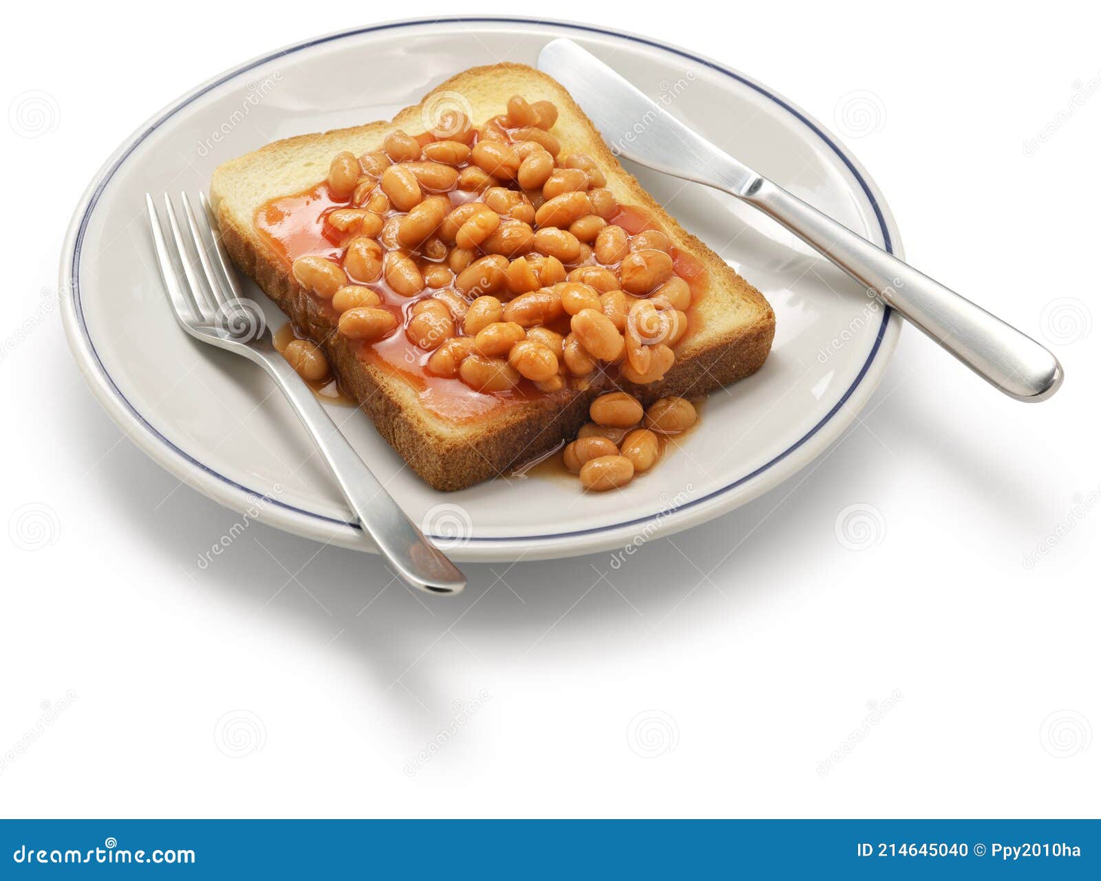 Baked beans on toast stock photo. Image of fork, sauce - 214645040