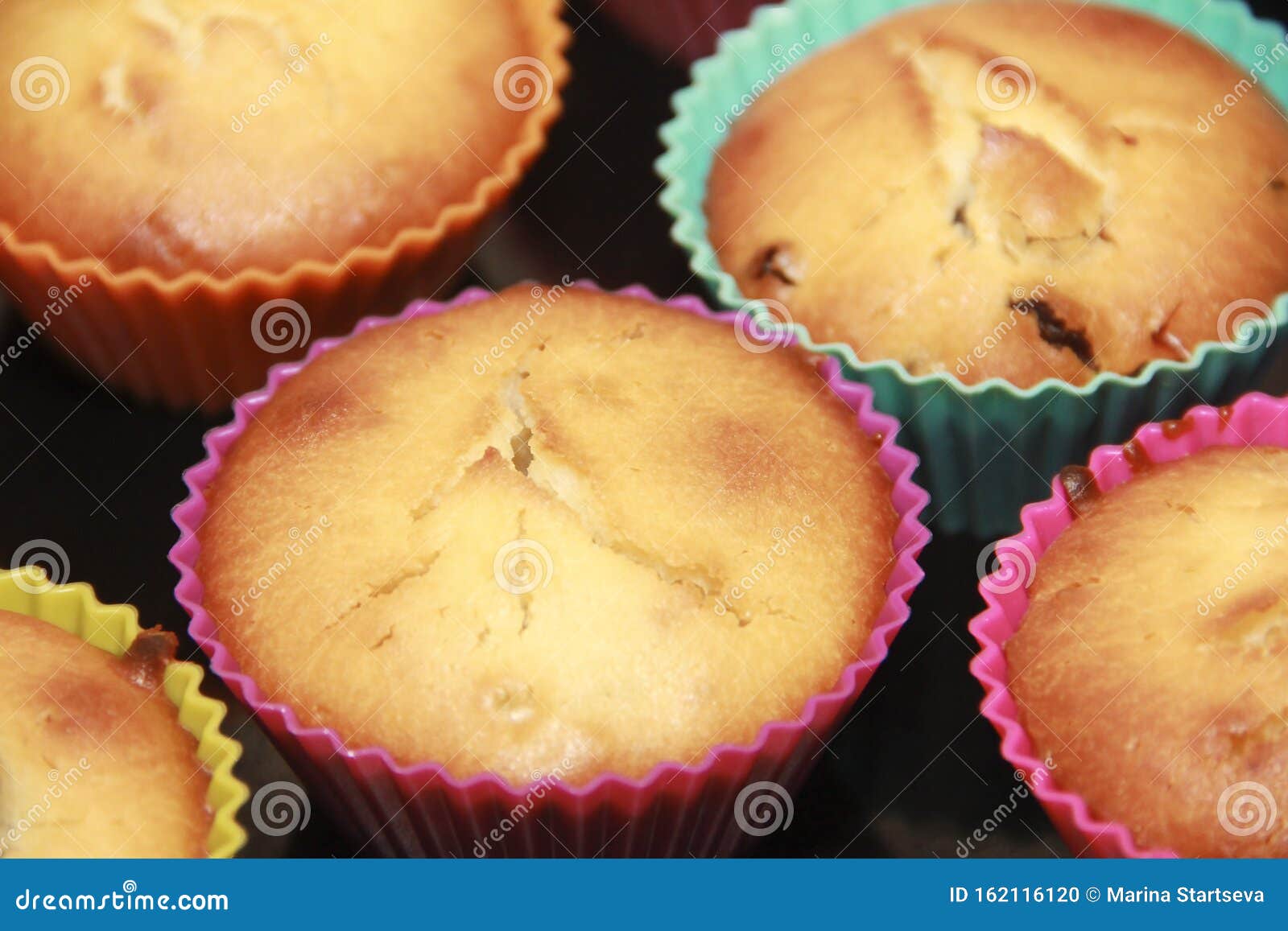 Baked Biscuit Muffins with Raisins in Multi-colored Silicone Molds ...
