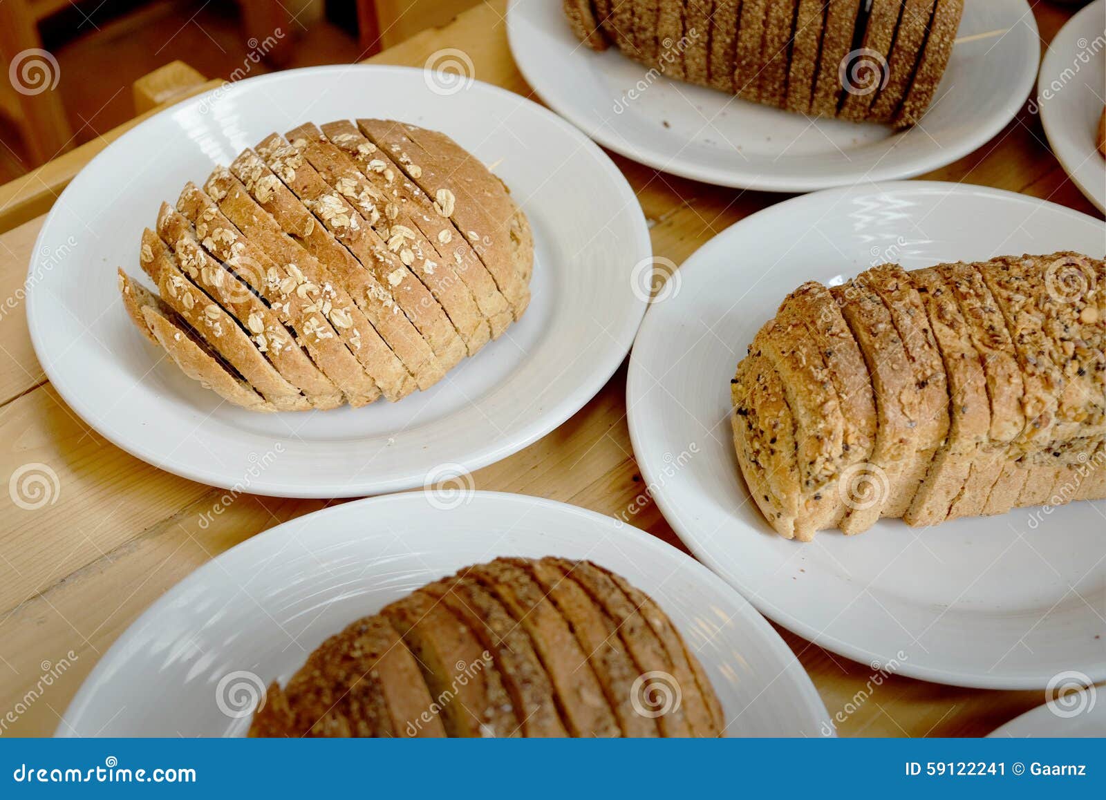 Baked Bread on White Plate and Wooden Table Stock Image - Image of ...