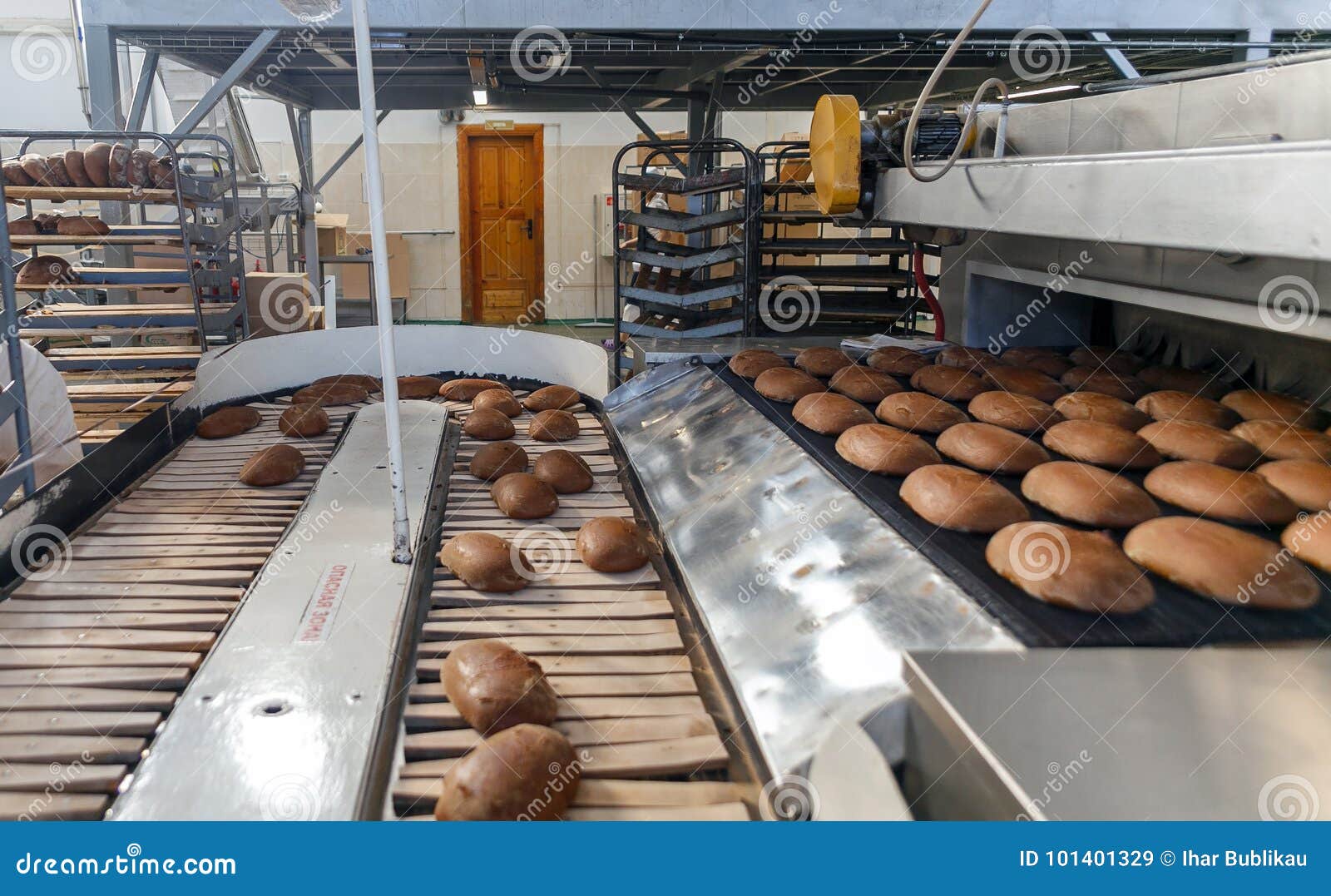 Baked Breads on the Production Line at the Bakery Stock Image - Image ...