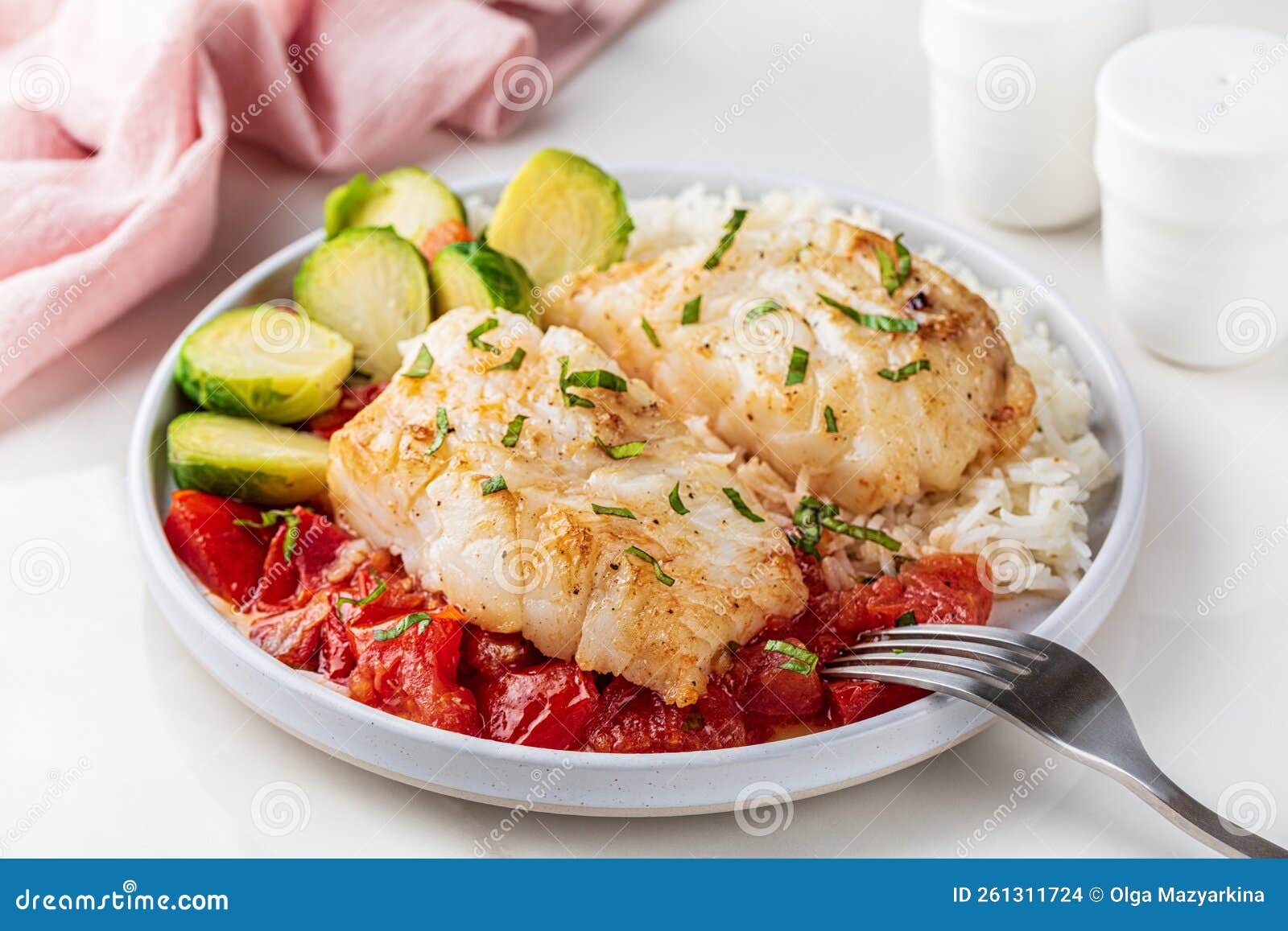 Baked Cod Fish, with Tomato, Brussel Sprouts and Boiled Rice. Stock ...