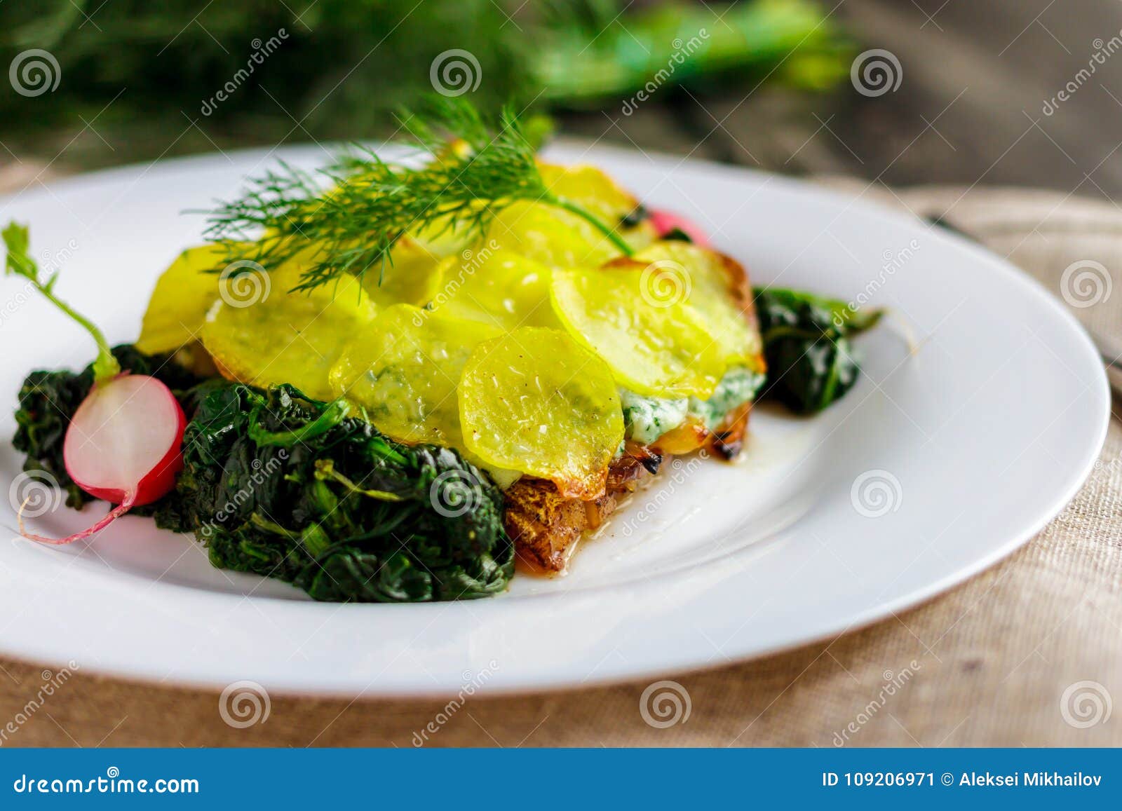 Baked Cod with Potatoes on a White Plate Partial Blurring Stock Image ...