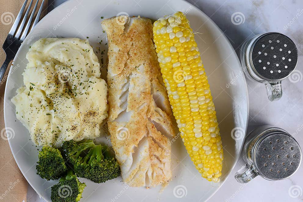Baked Cod Served with Corn and Mashed Potatoes Stock Image - Image of ...