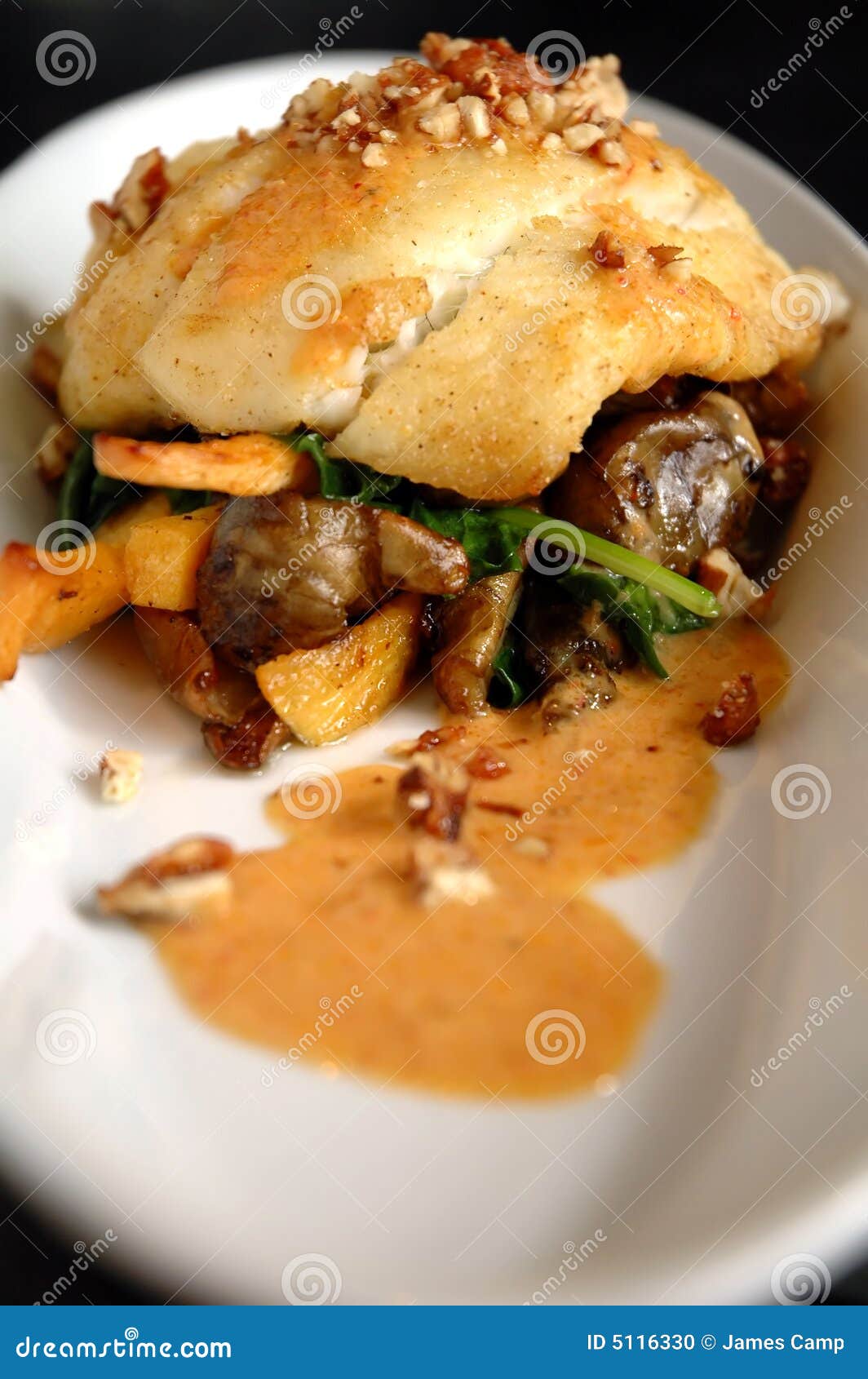 Baked fish stock photo. Image of seafood, nuts, spinach - 5116330