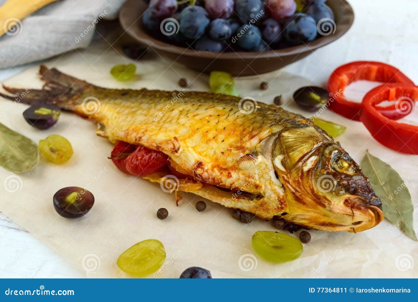 Baked Fish Carp, Stuffed Bell Peppers and Grapes Stock Image - Image of ...