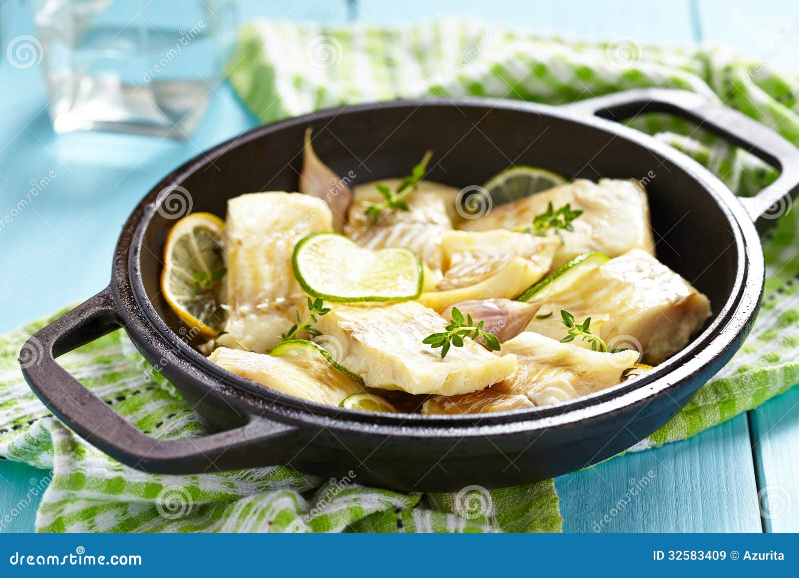 Baked Fish Fillet with Lime and Garlic Stock Image - Image of green ...