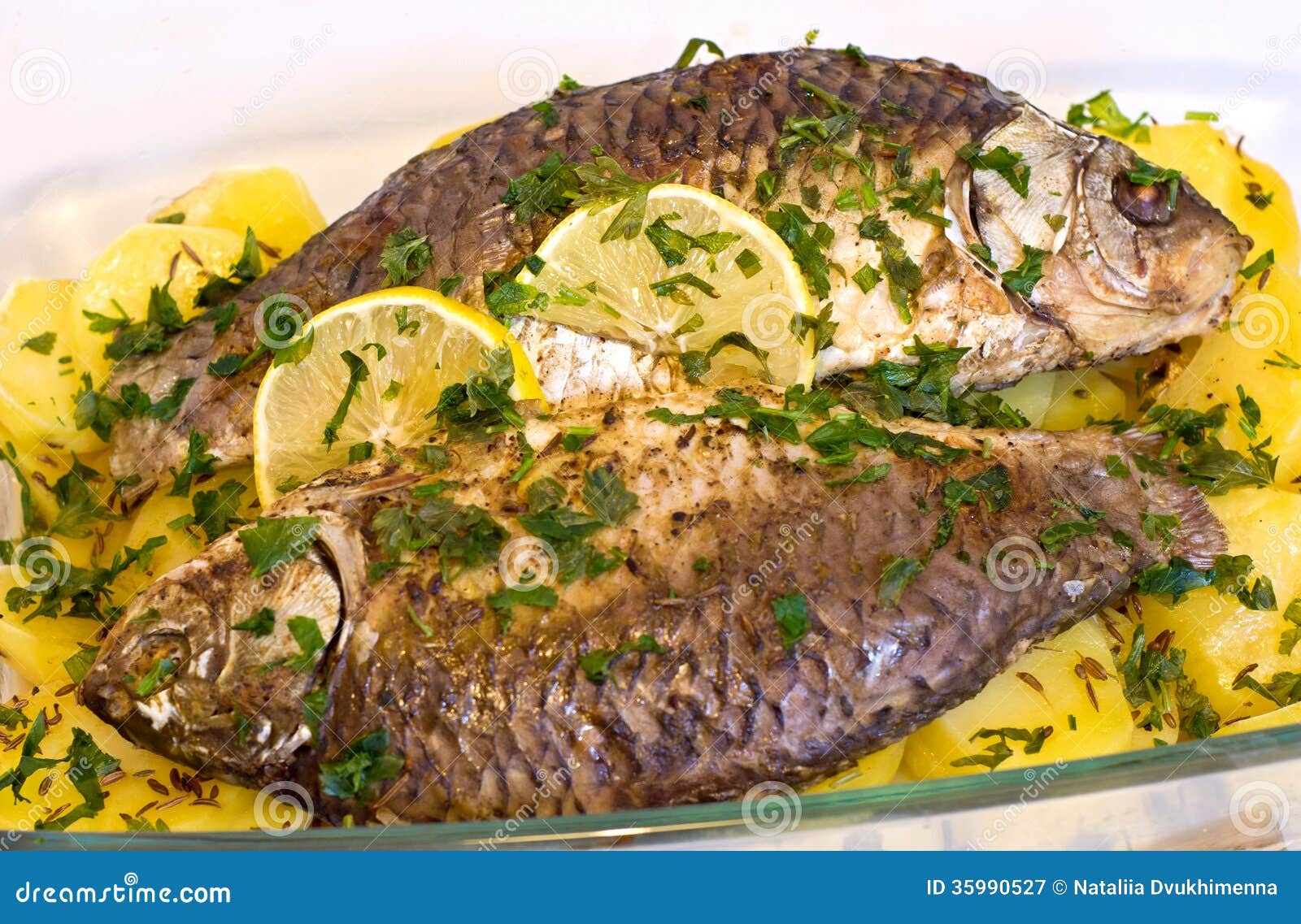 Baked fish and potatoes stock image. Image of nutriment - 35990527