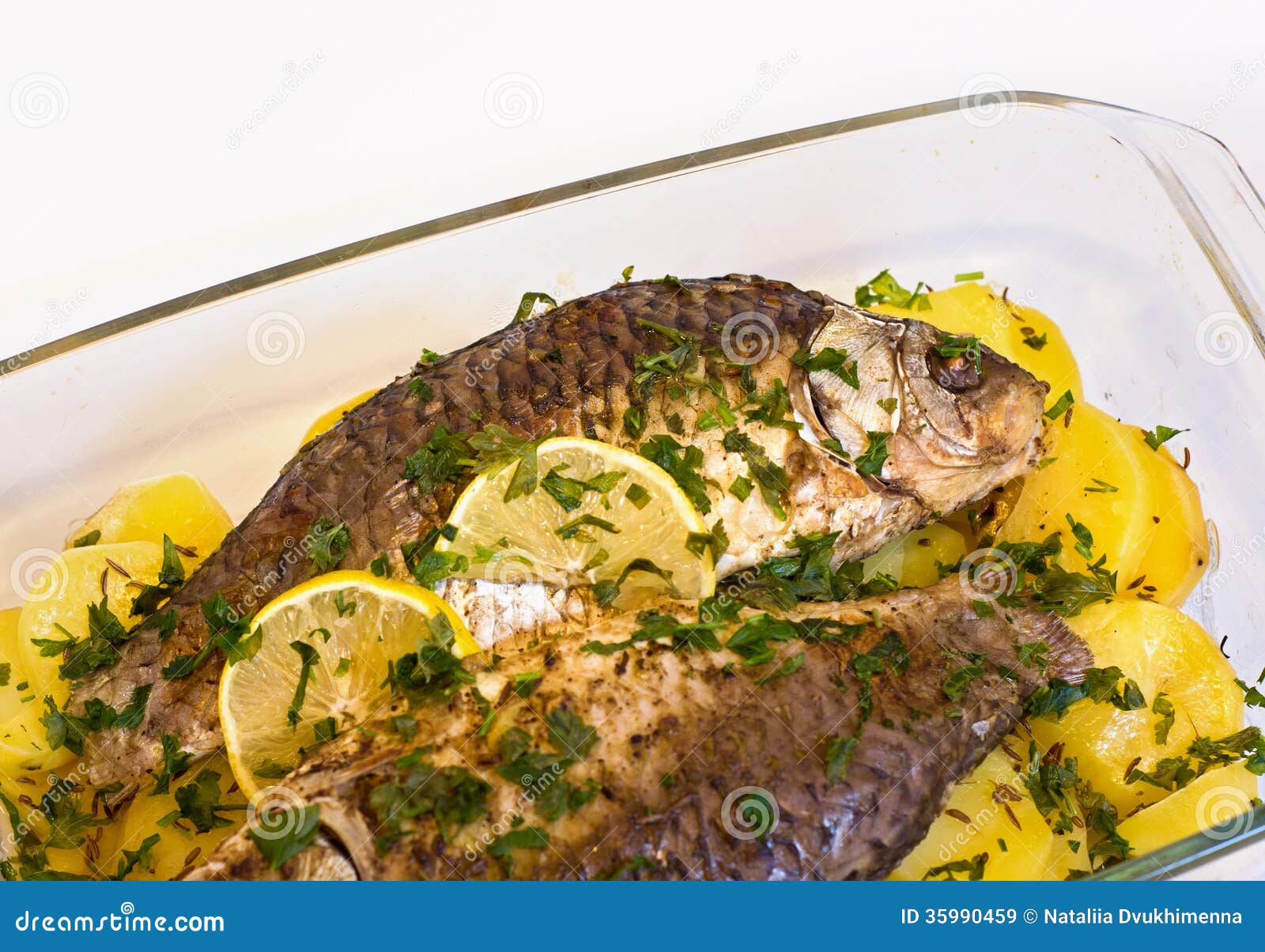 Baked fish and potatoes stock image. Image of baked, food - 35990459